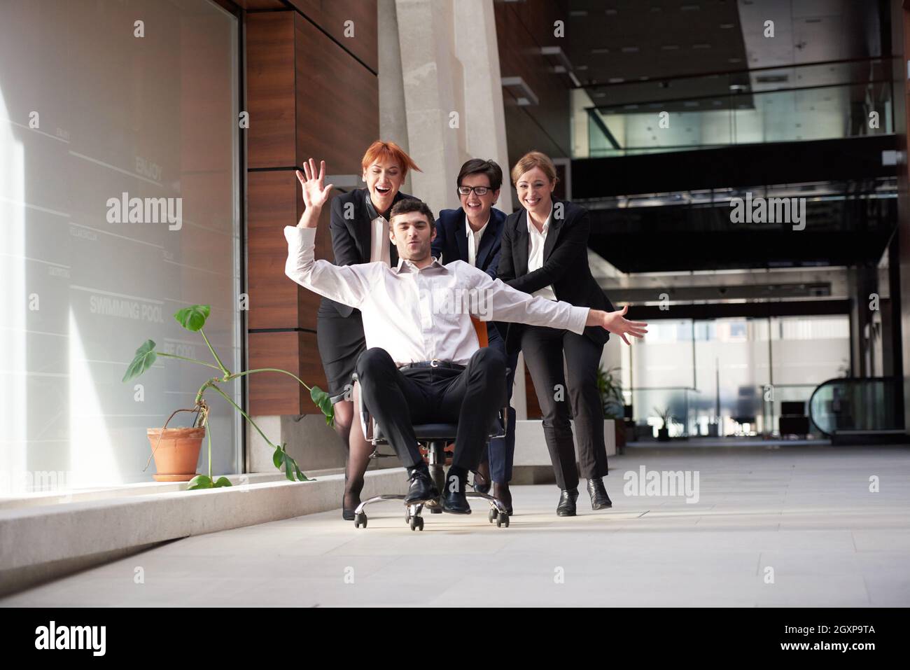 business people group at modern office indoors have fun and push office ...