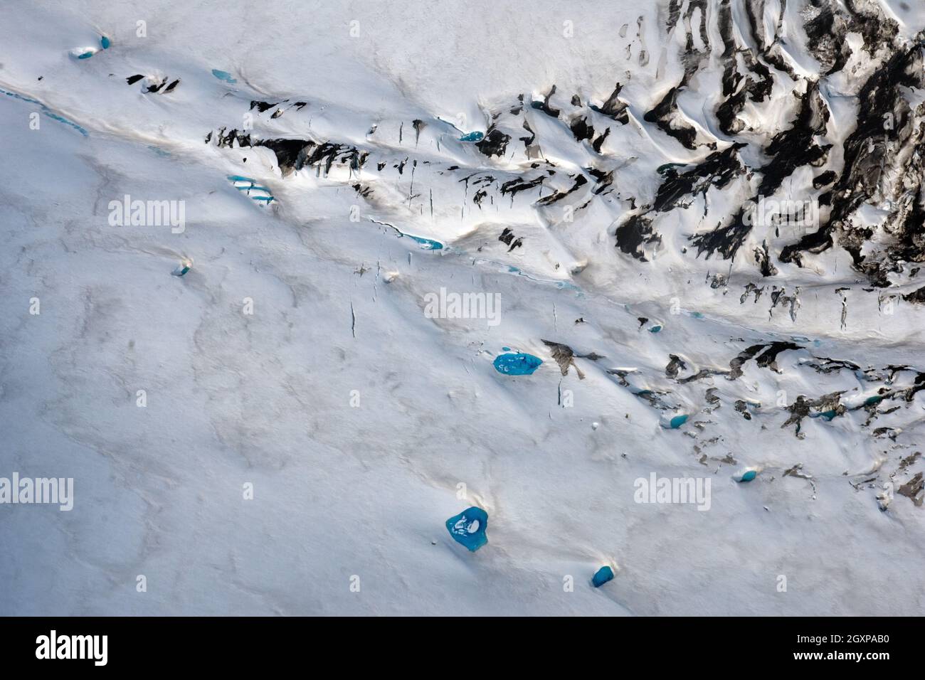Glacier pools with crystal blue water or moulins at Denali National ...
