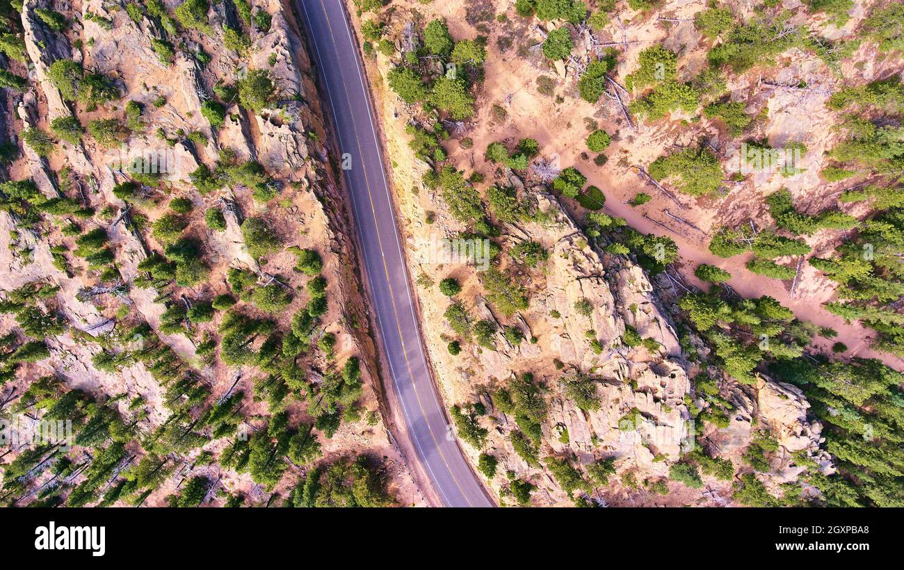 Aerial looking down road through rocky desert landscape Stock Photo - Alamy