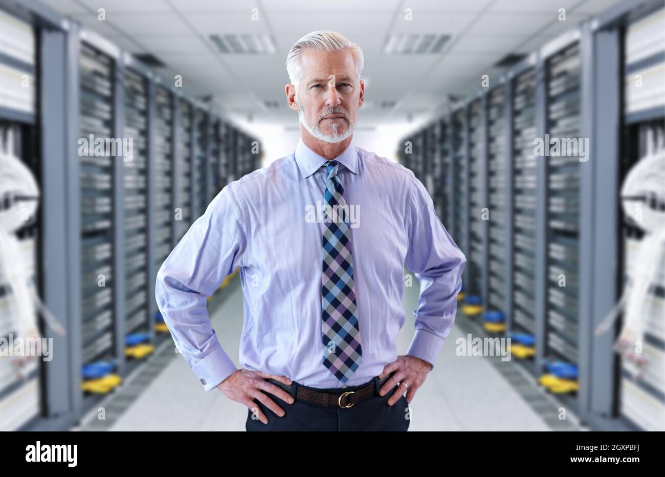 Portrait of senior businessman in big rack server room Stock Photo - Alamy