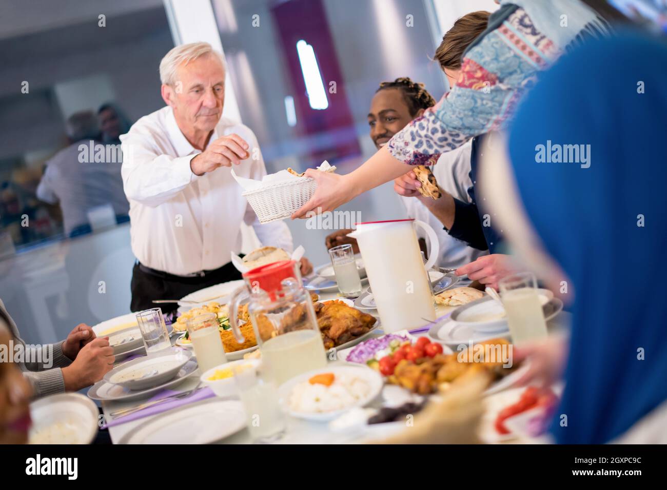 modern multiethnic muslim family enjoying eating iftar dinner together ...