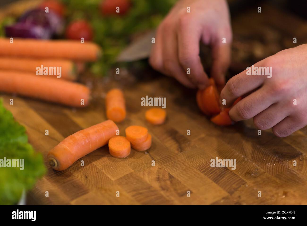 closeup of Chef hands in hotel or restaurant kitchen preparing beef ...