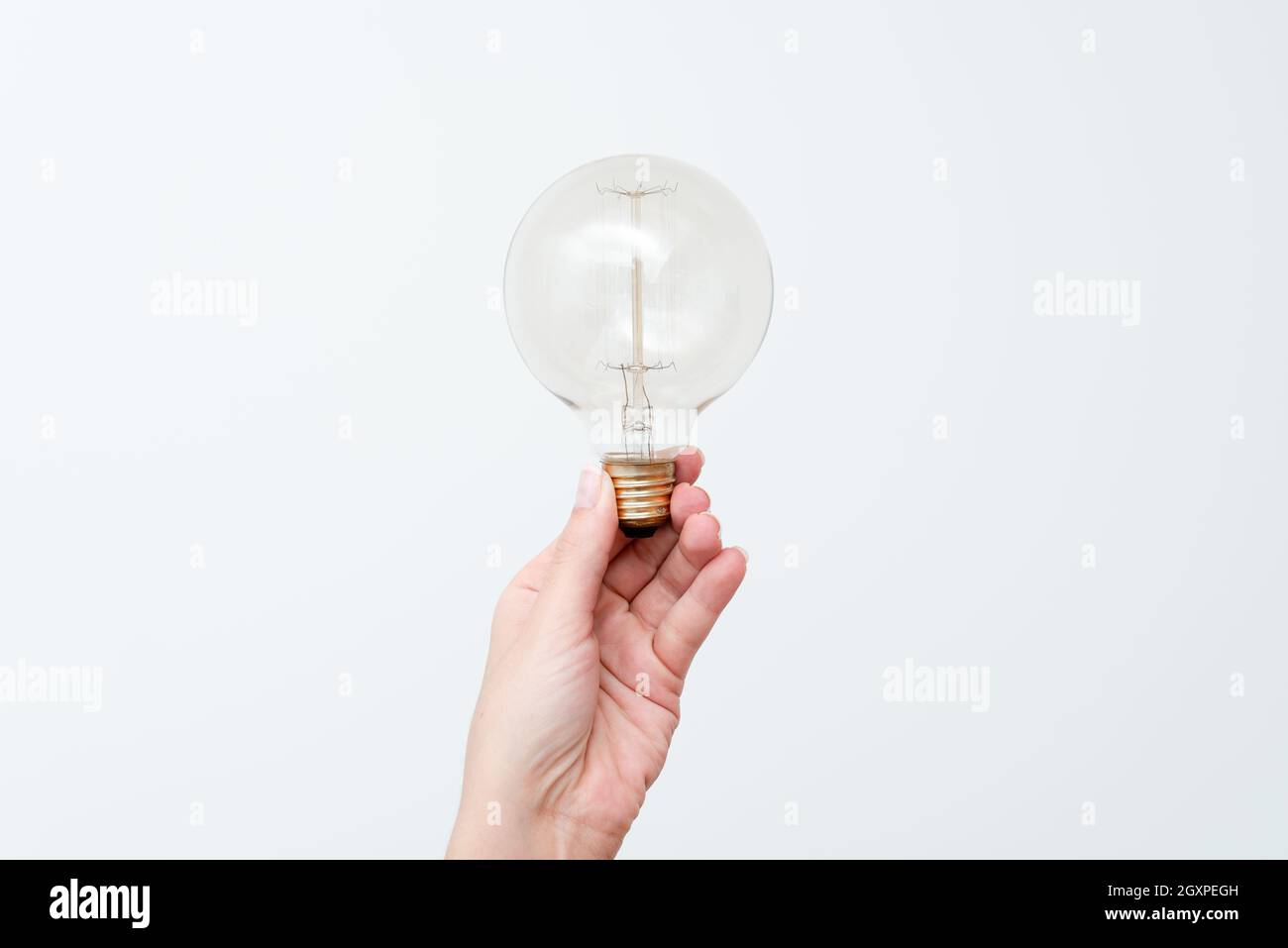 Woman Holding Lamp Presenting New Ideas For Project, Man Hand Showing ...