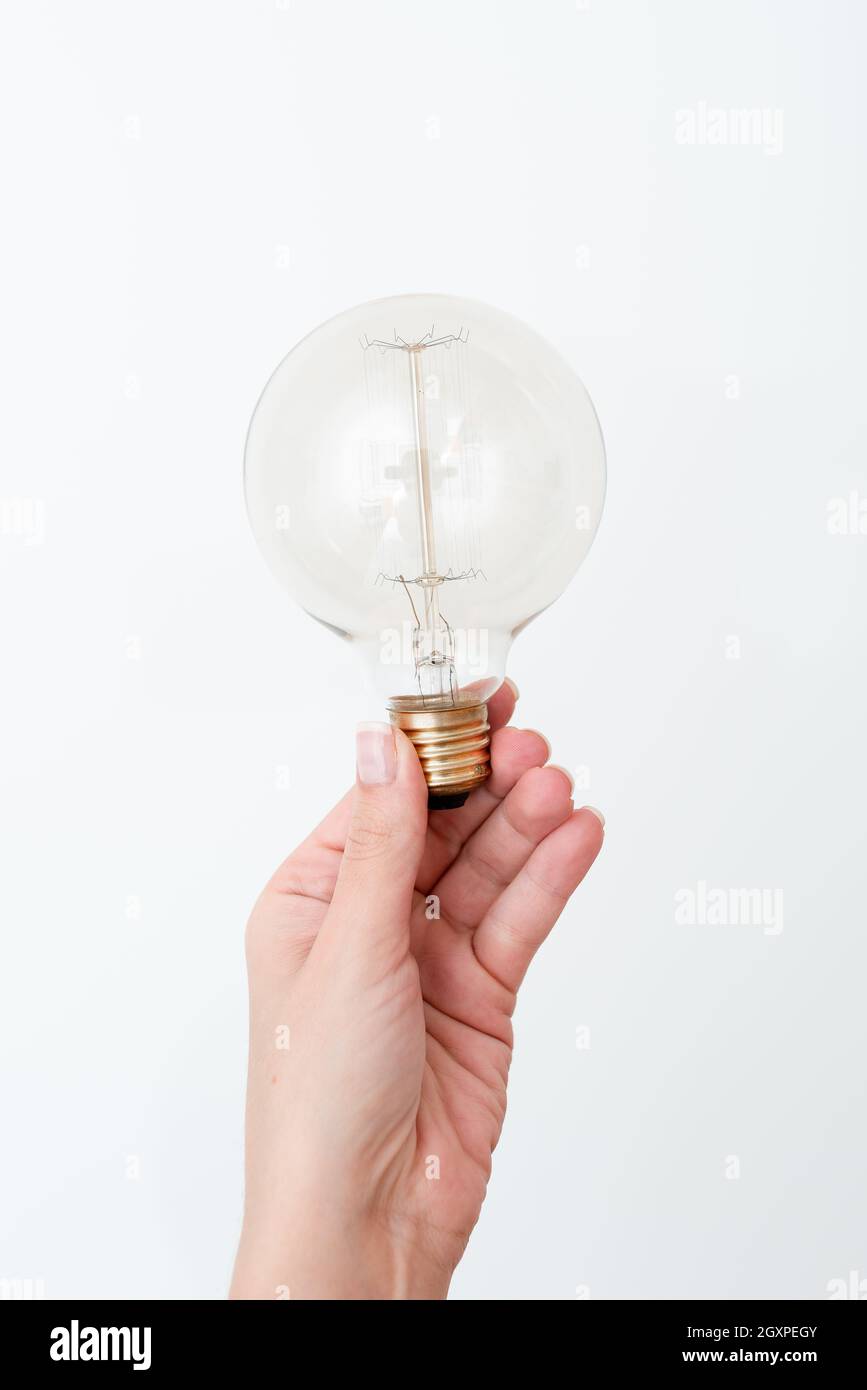 Woman Holding Lamp Presenting New Ideas For Project, Man Hand Showing ...
