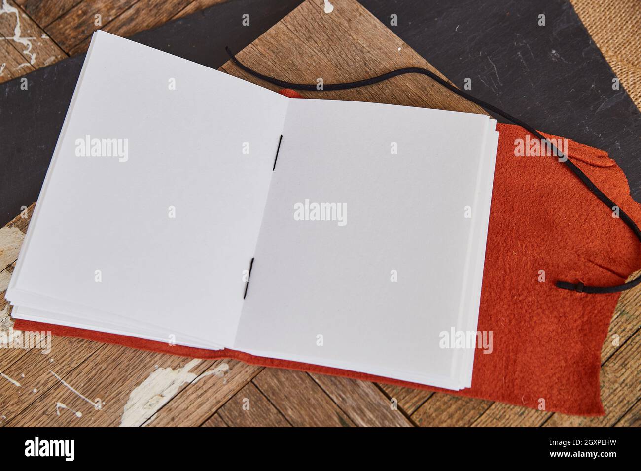 open notebook with post it on wood background Stock Photo - Alamy
