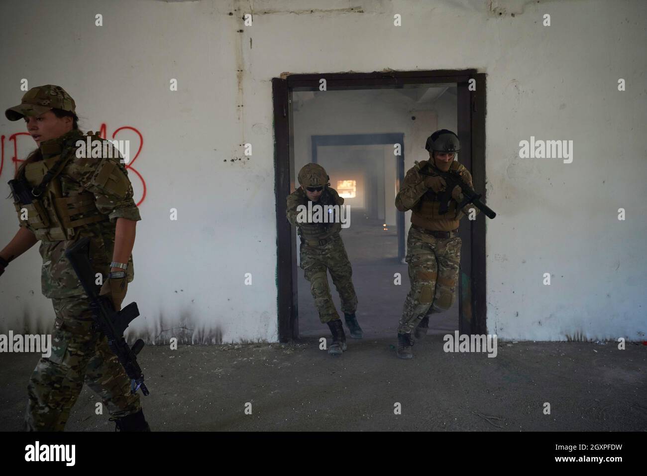 special forces soldiers team in urban environment making tactical ...