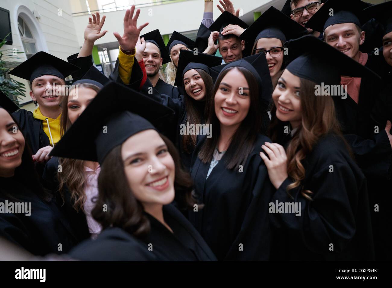 education, graduation, technology and people concept - group of happy ...