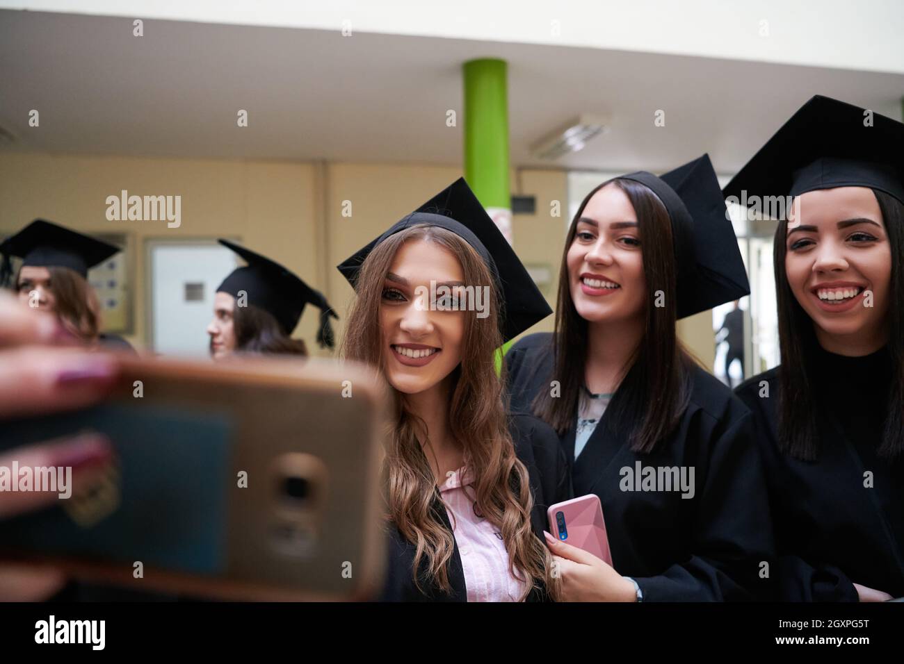 education, graduation, technology and people concept - group of happy ...
