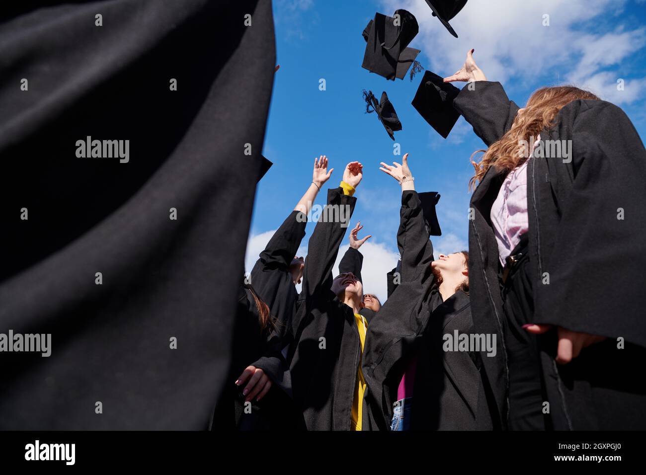 Congratulations! Low angle view of happy group of six young cheerful ...