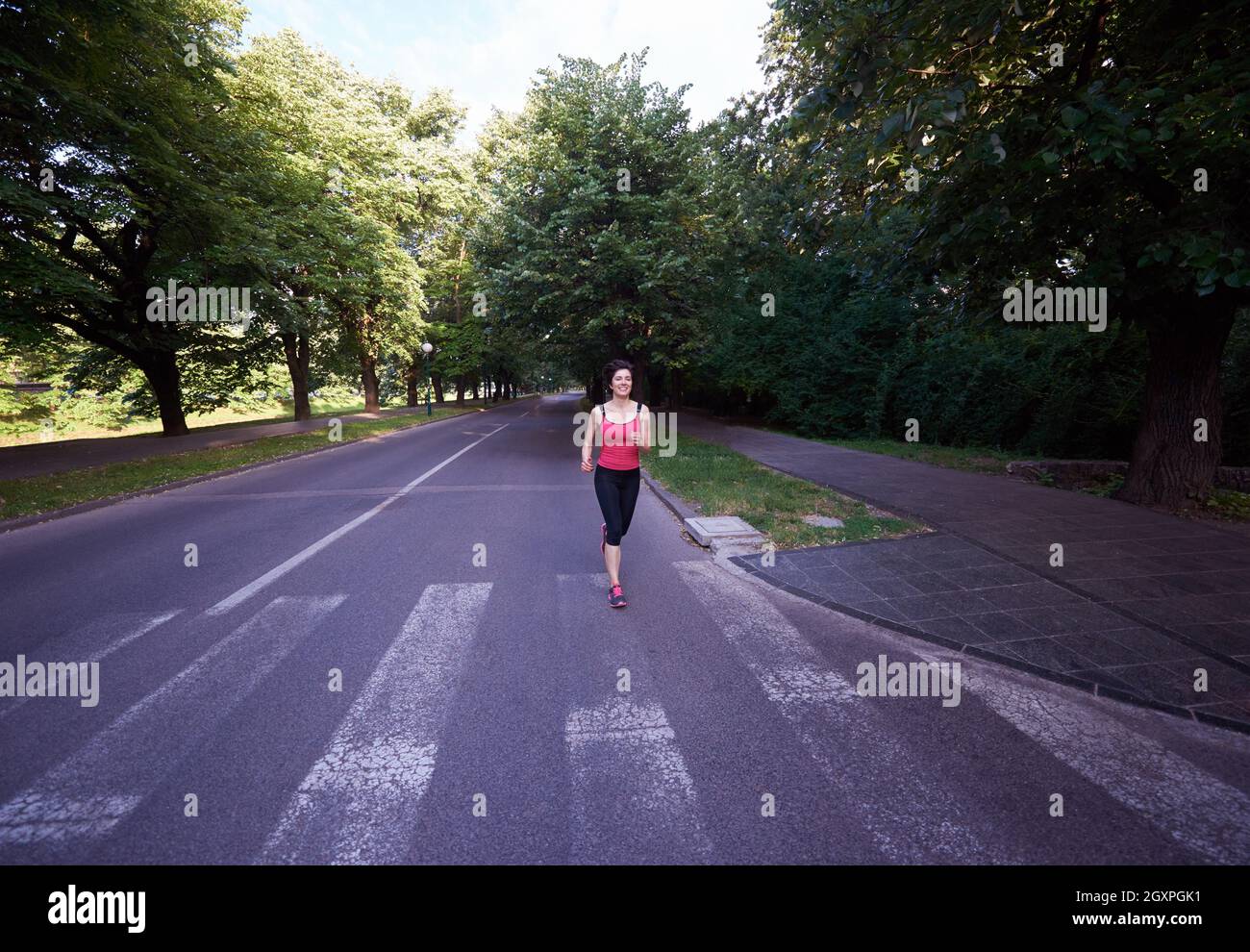 Woman jogging in the dark hi-res stock photography and images - Alamy