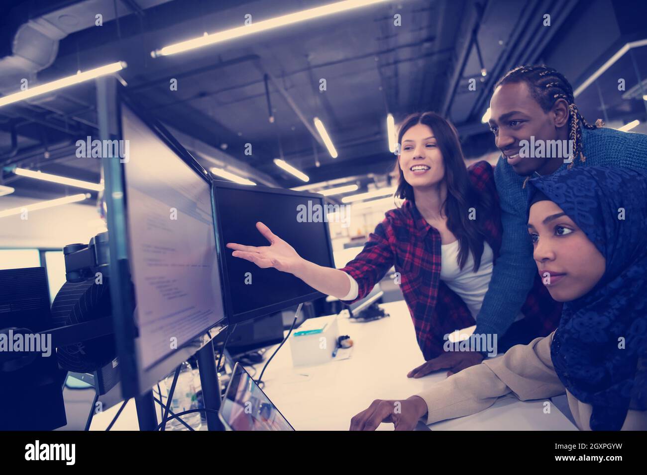 young multiethnics business team of software developers working ...