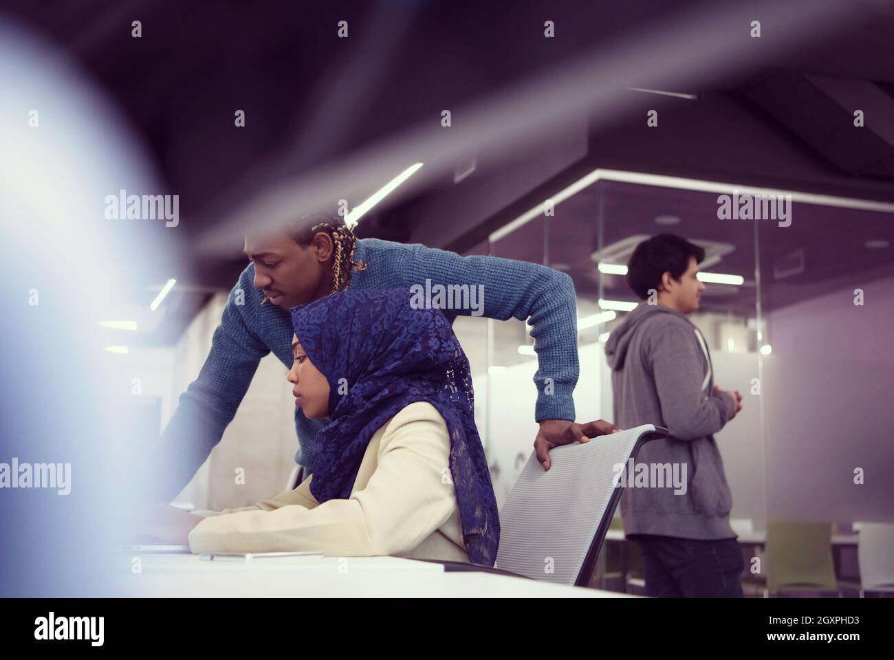 black muslim female software developer working together with her ...