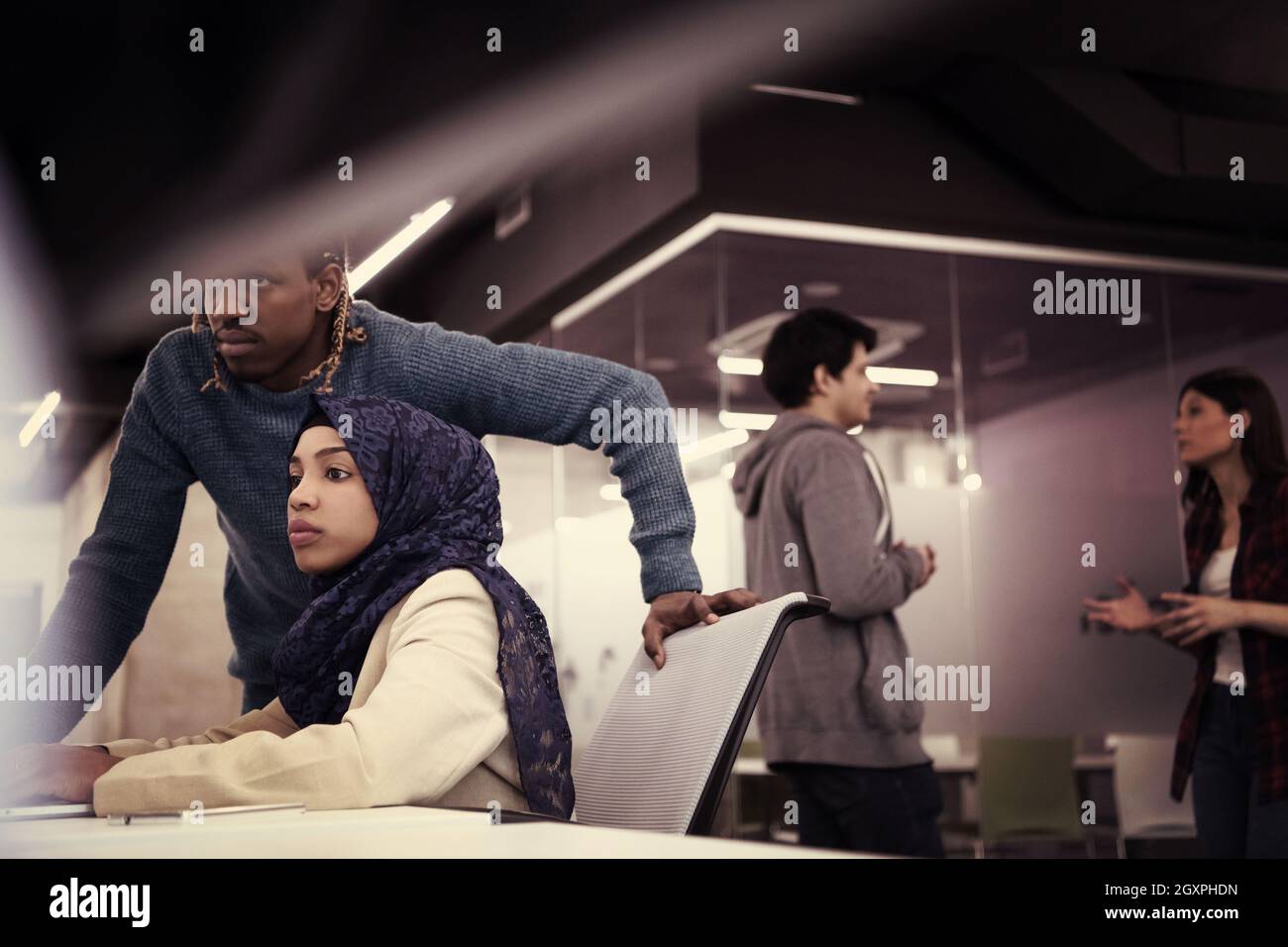 black muslim female software developer working together with her ...