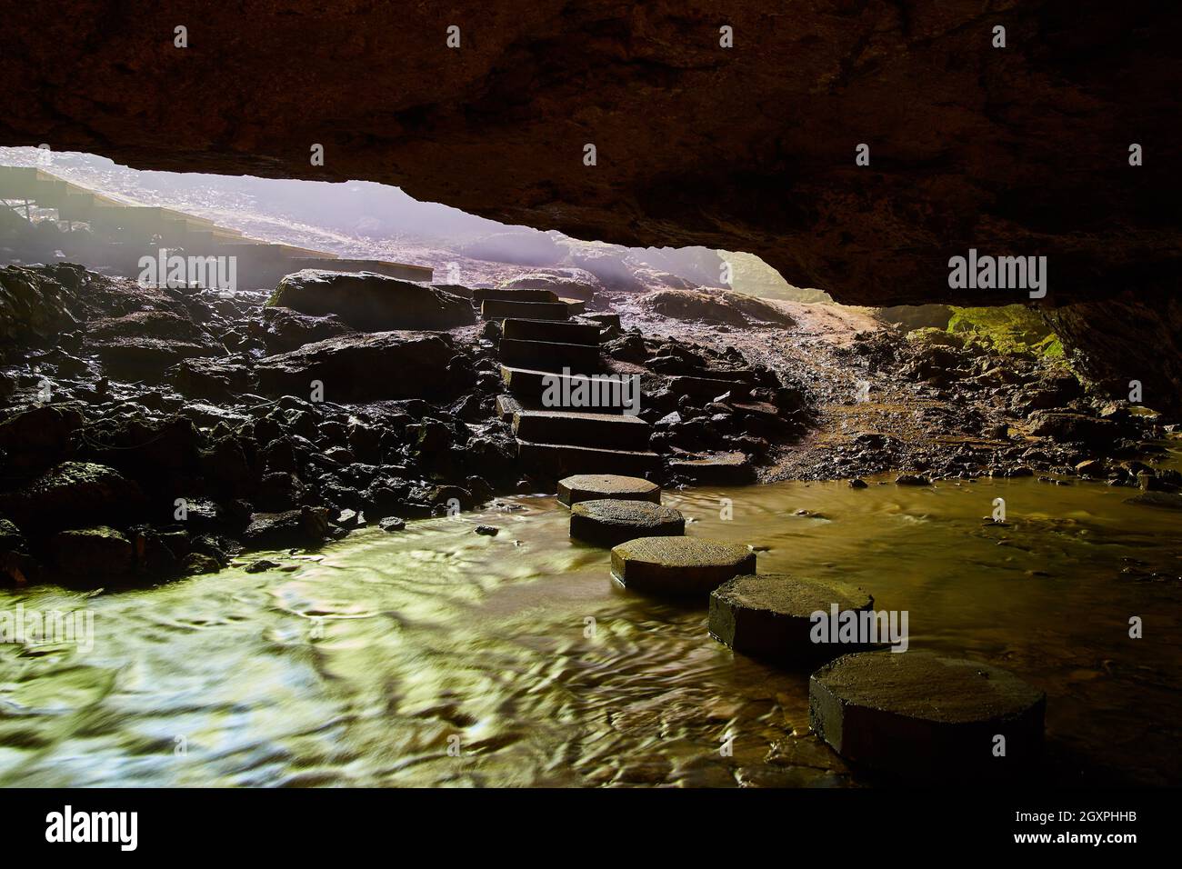 Steps in cave over river Stock Photo - Alamy