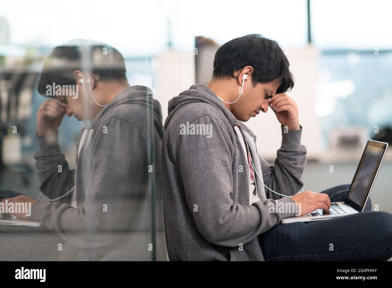 young indian software developer man using laptop computer writing ...