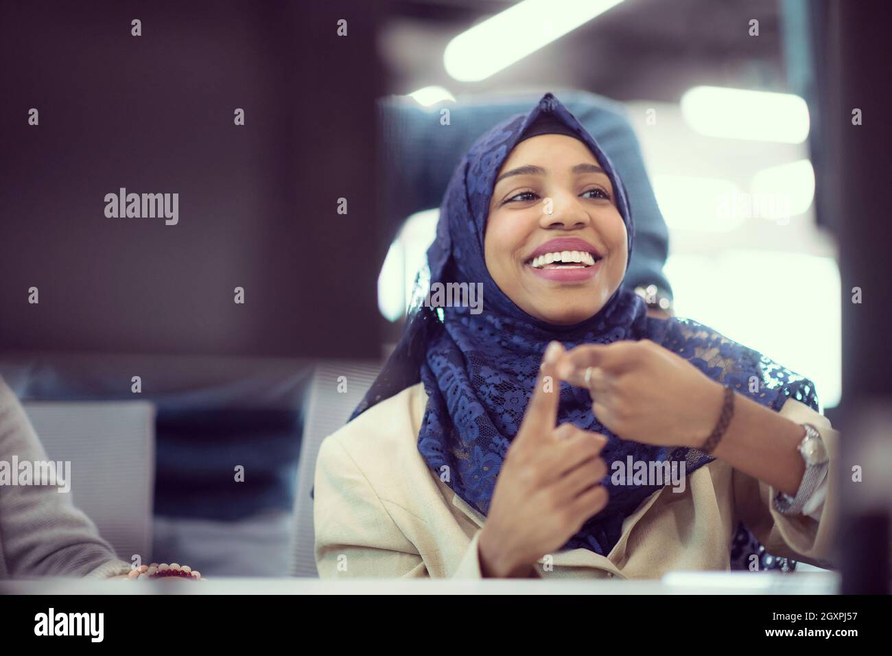 black muslim female software developer working together with her ...