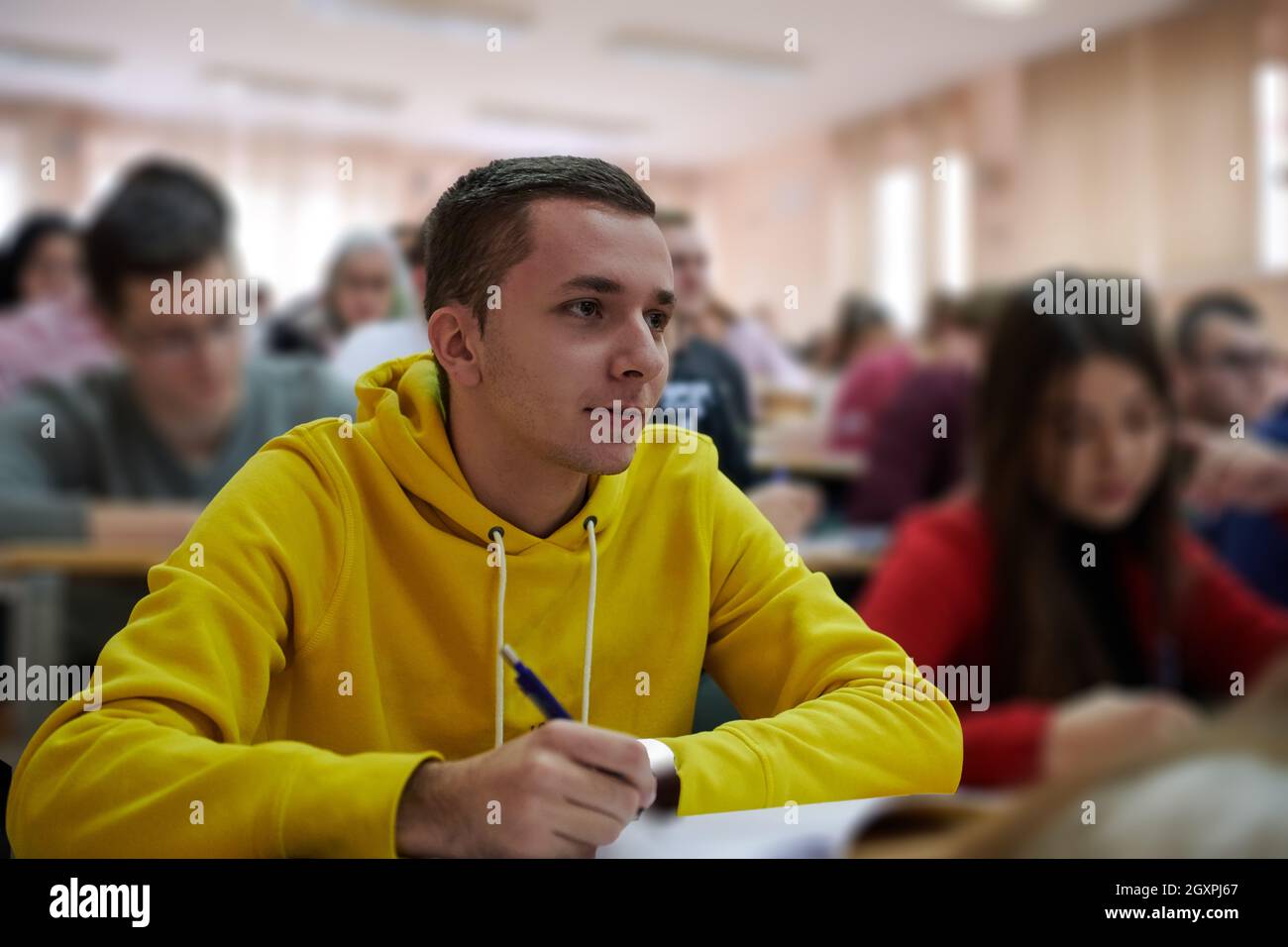student taking notes while studying in high school. Portrait of college ...