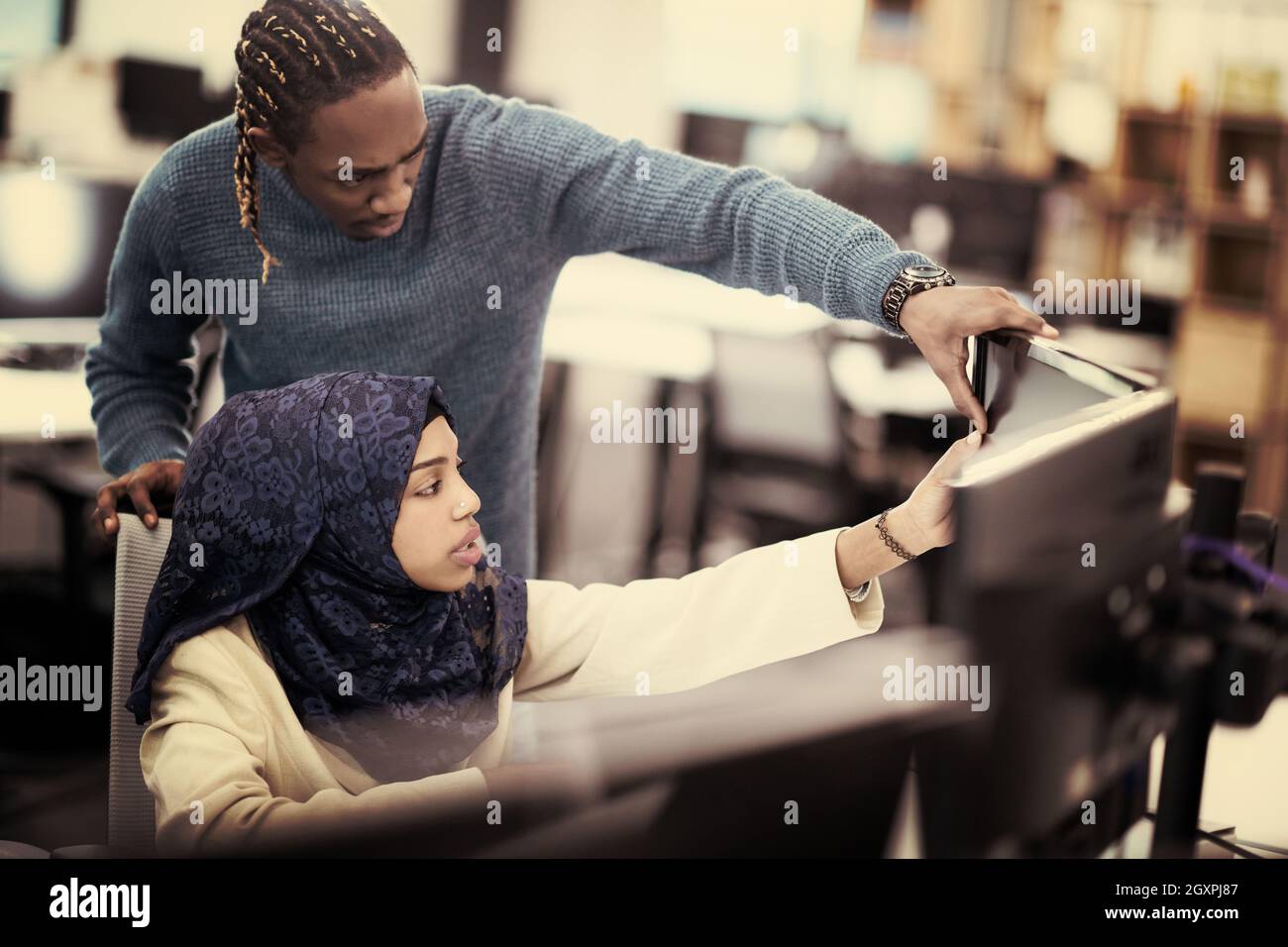 black muslim female software developer working together with her ...