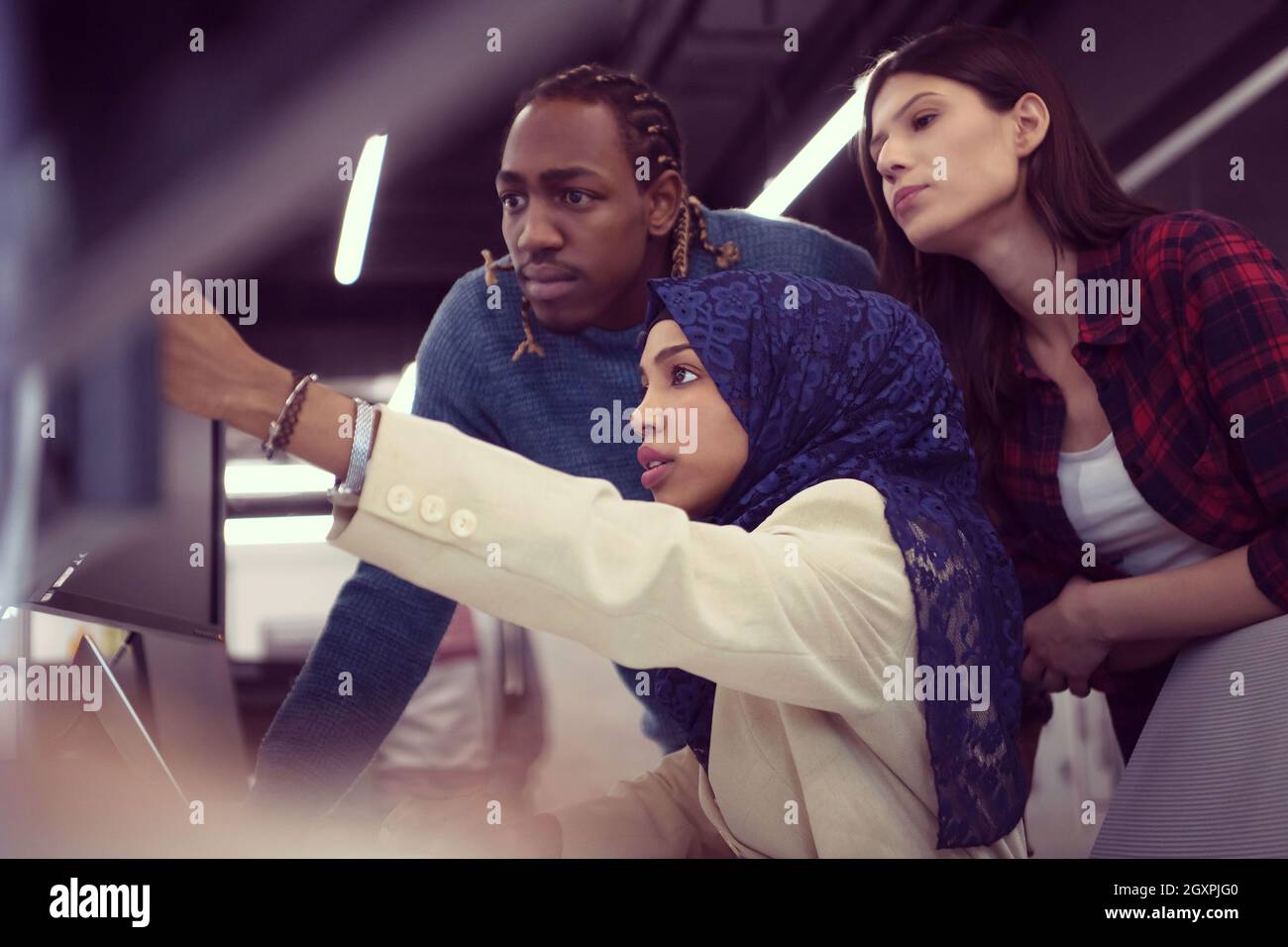 young multiethnics business team of software developers working ...