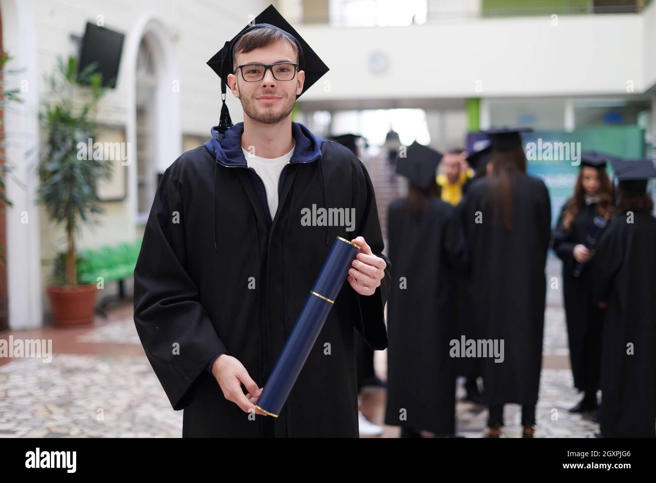 Happy man portrait on her graduation day University. Education and ...