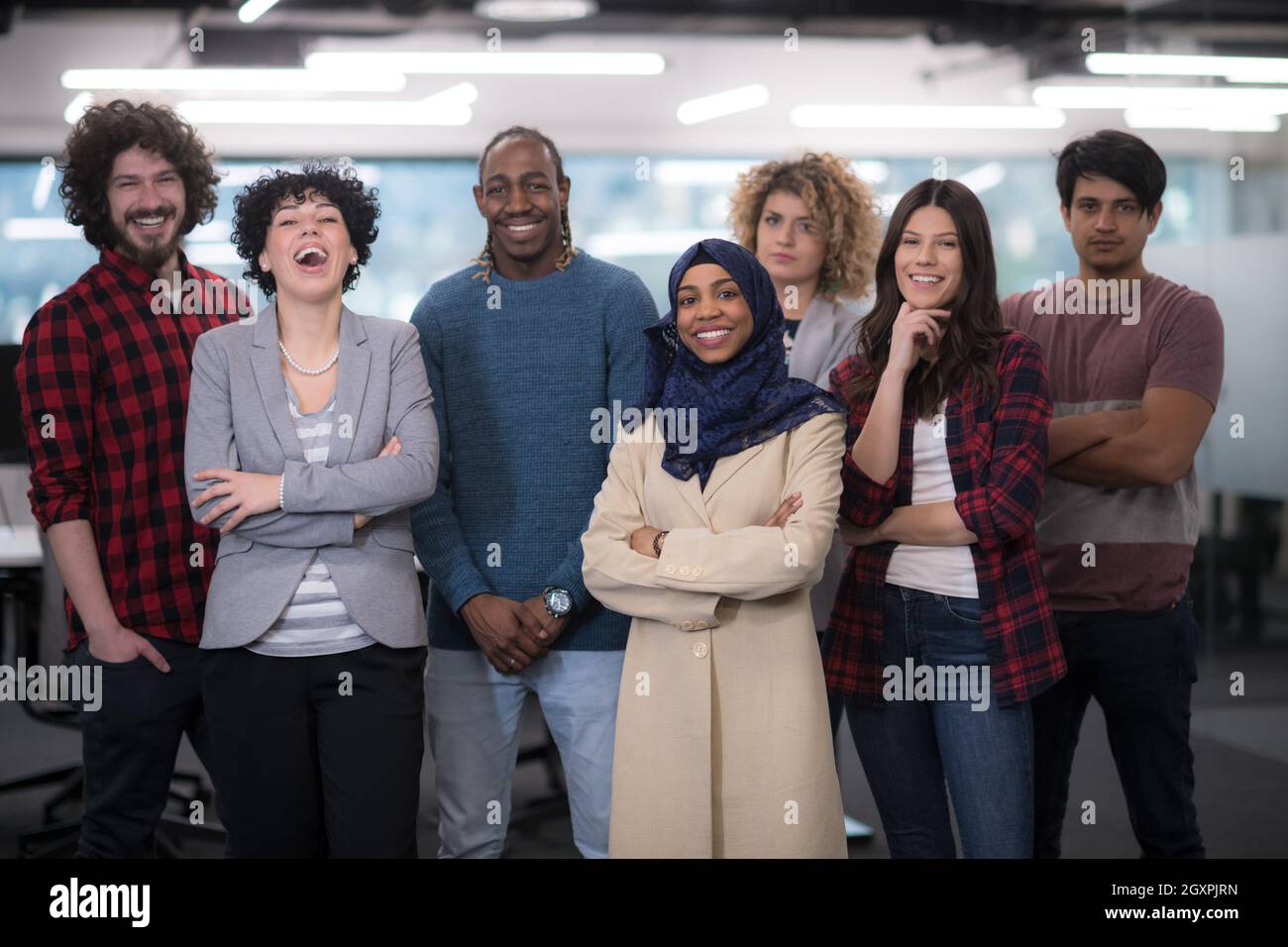 portrait of young excited multiethnics business team of software ...