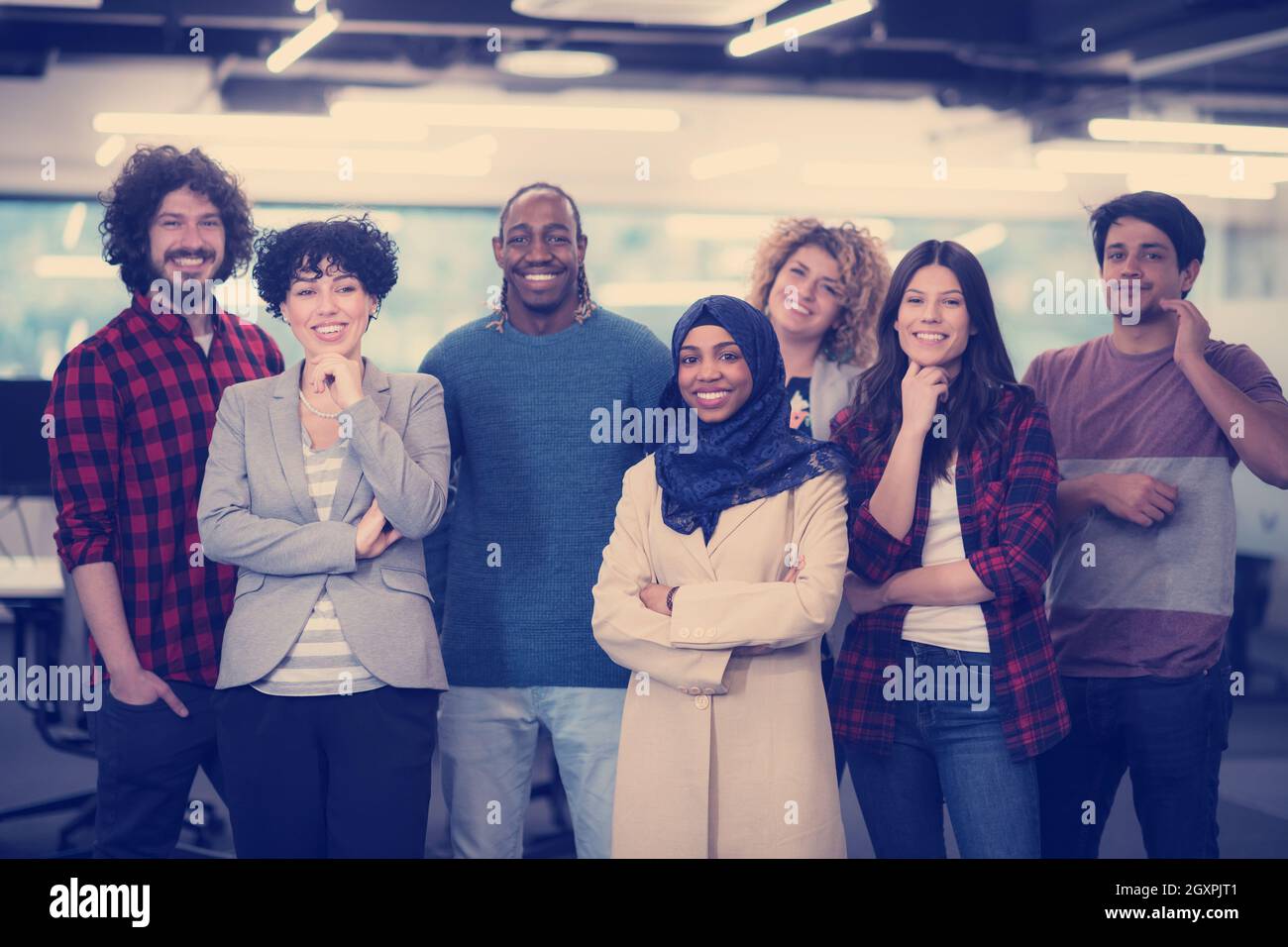 portrait of young excited multiethnics business team of software ...