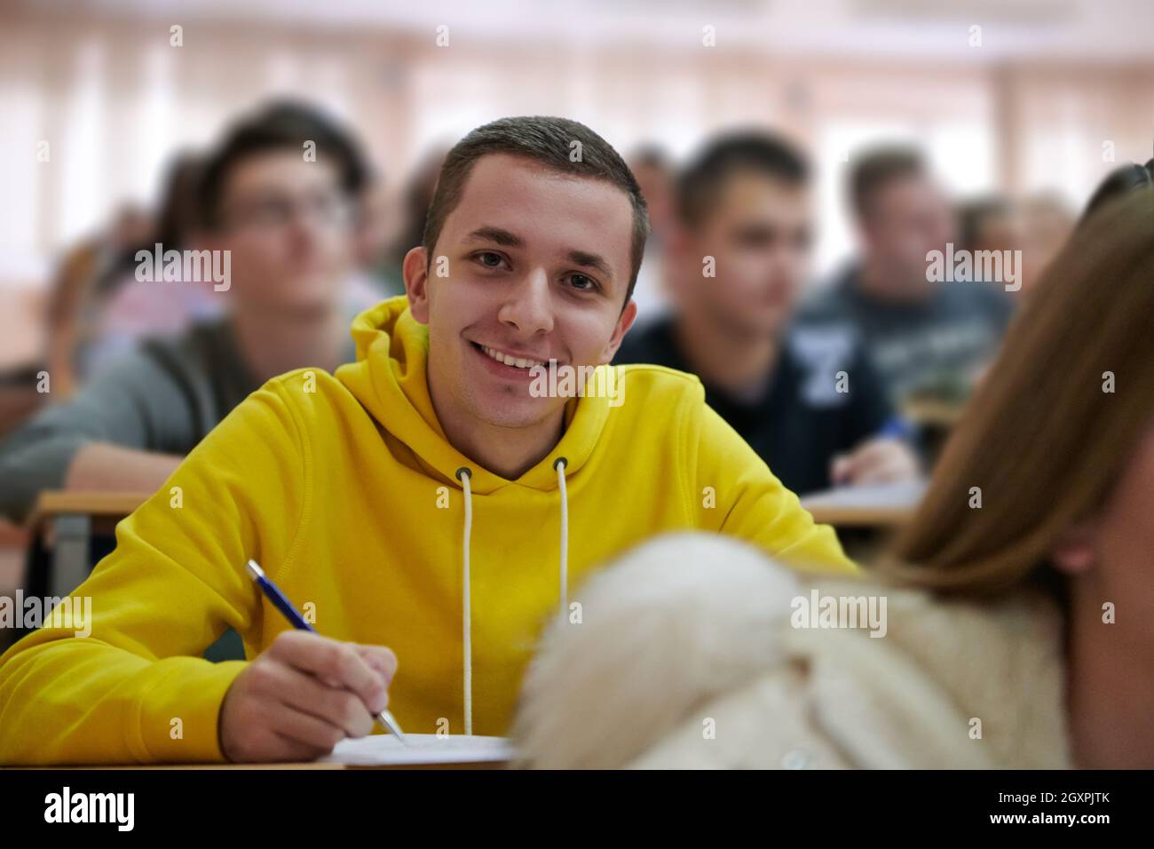 student taking notes while studying in high school. Portrait of college ...