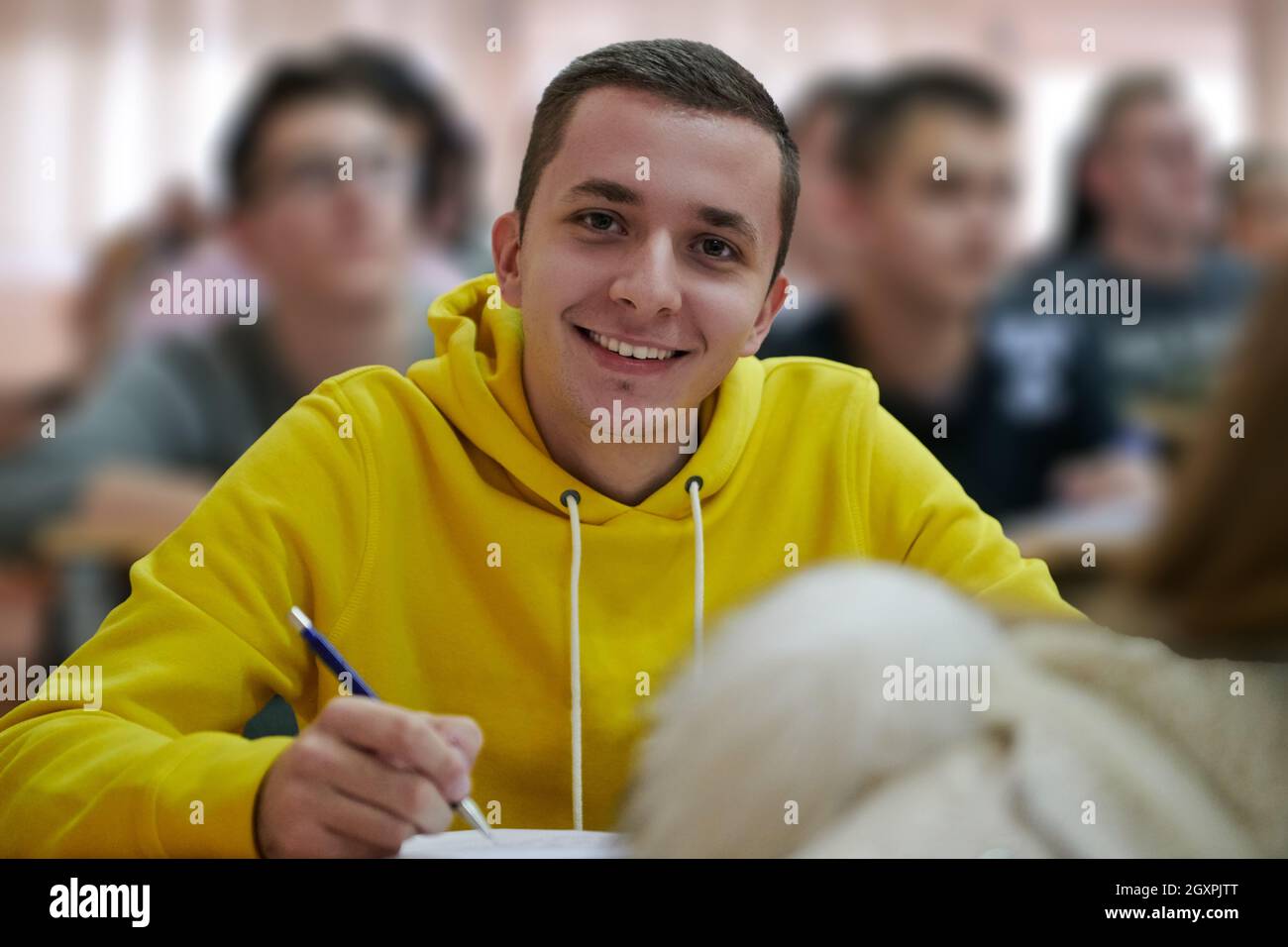 student taking notes while studying in high school. Portrait of college ...