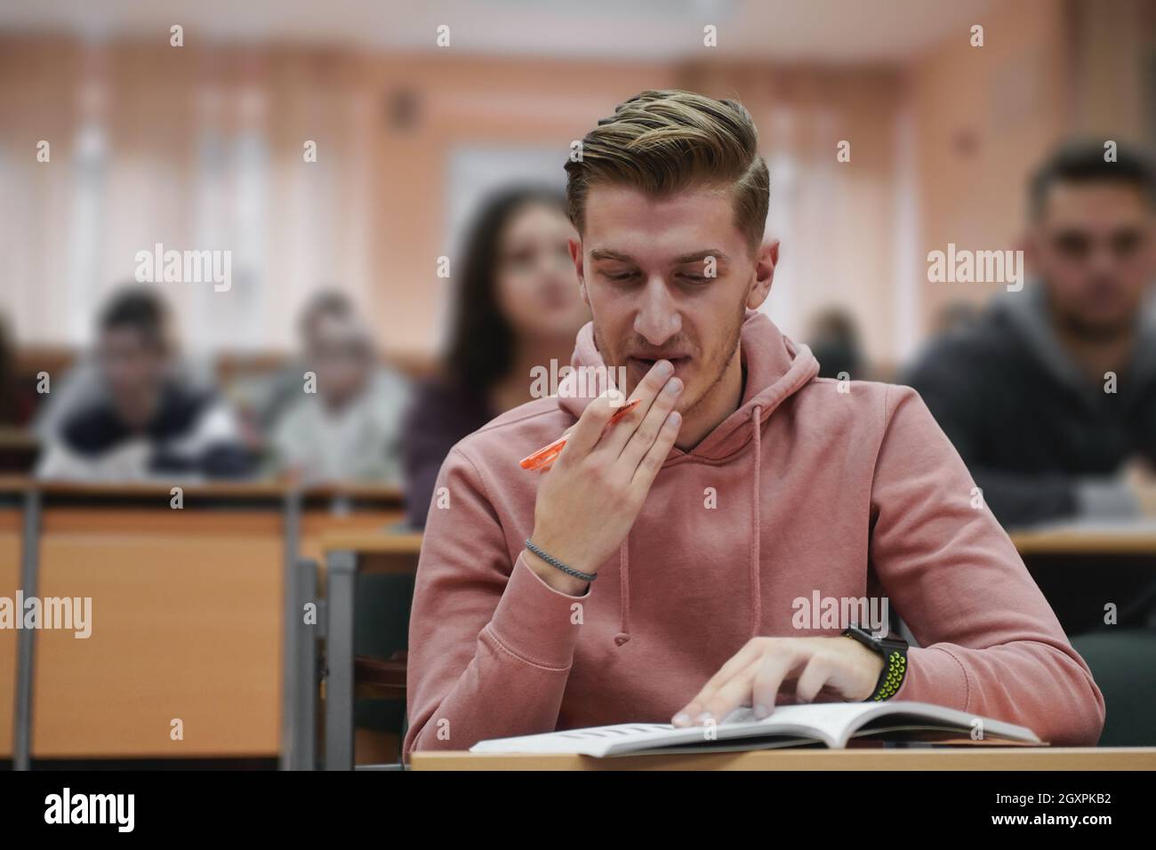 student taking notes while studying in high school. Portrait of college ...