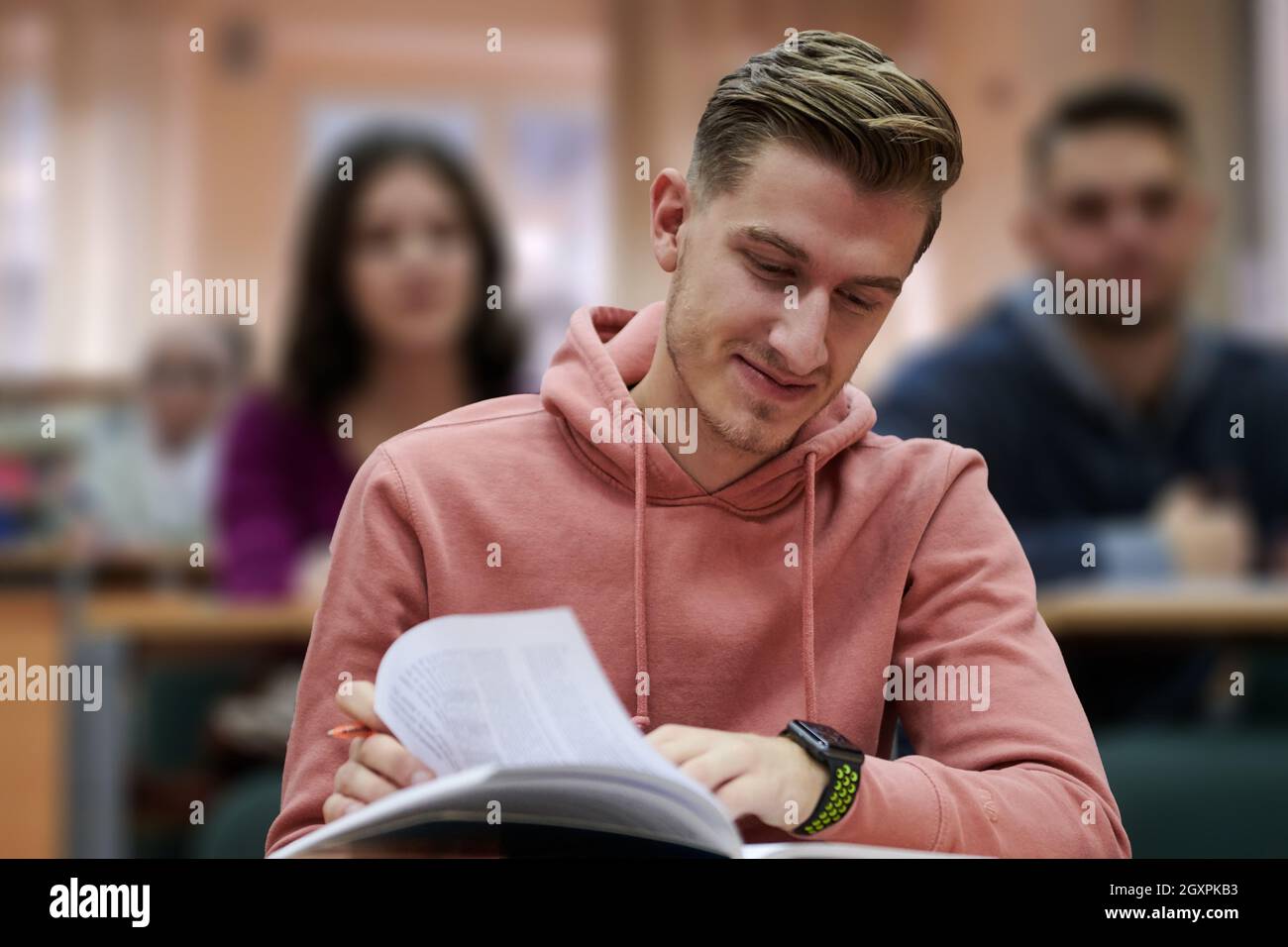 student taking notes while studying in high school. Portrait of college ...