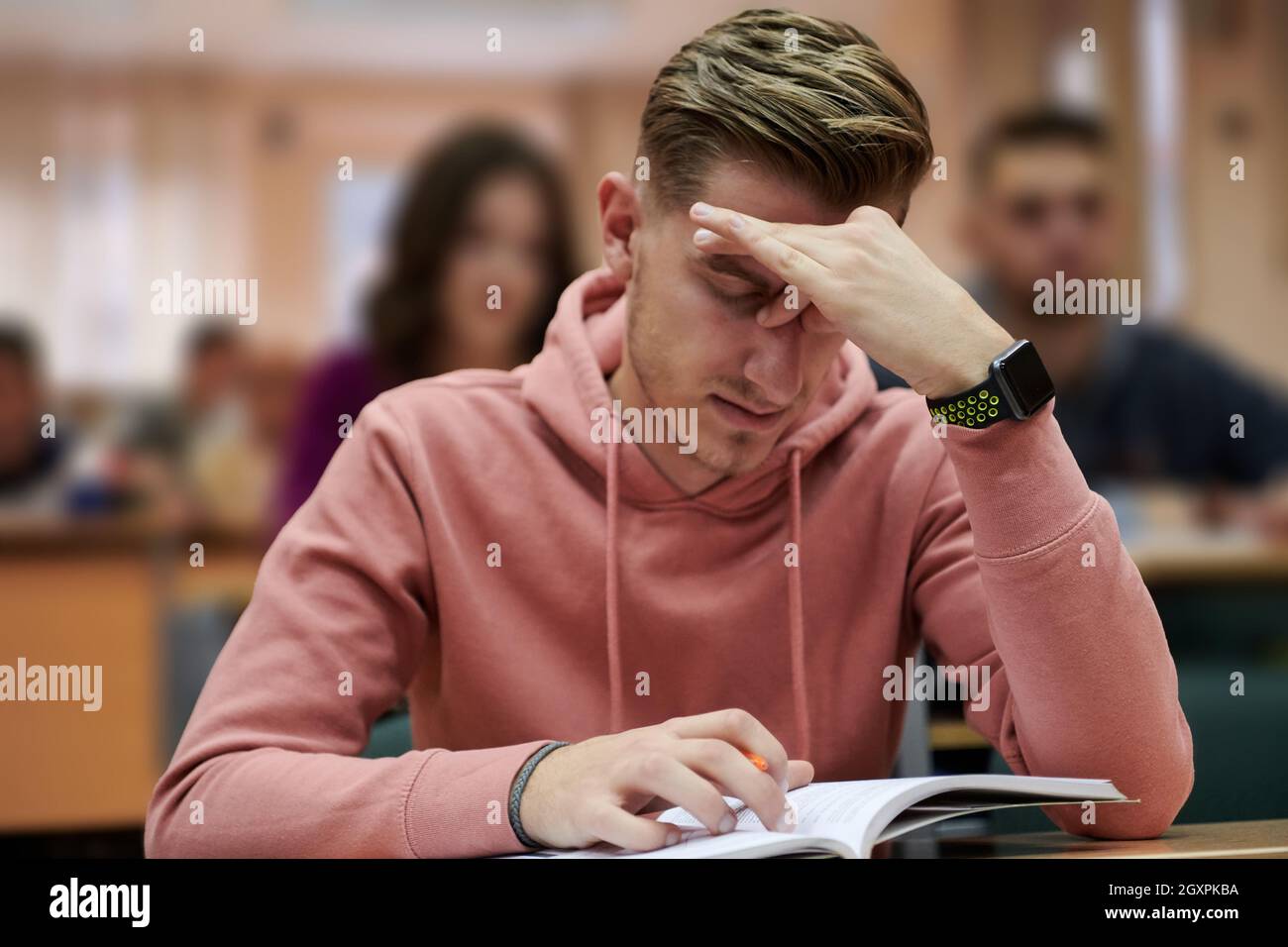 The Student Has Headaches While Listening To A Math Class In College the-student-has-headaches-while-listening-to-a-math-class-in-college