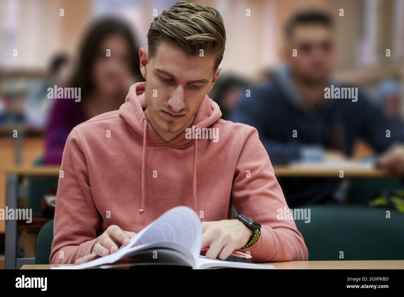 student taking notes while studying in high school. Portrait of college ...