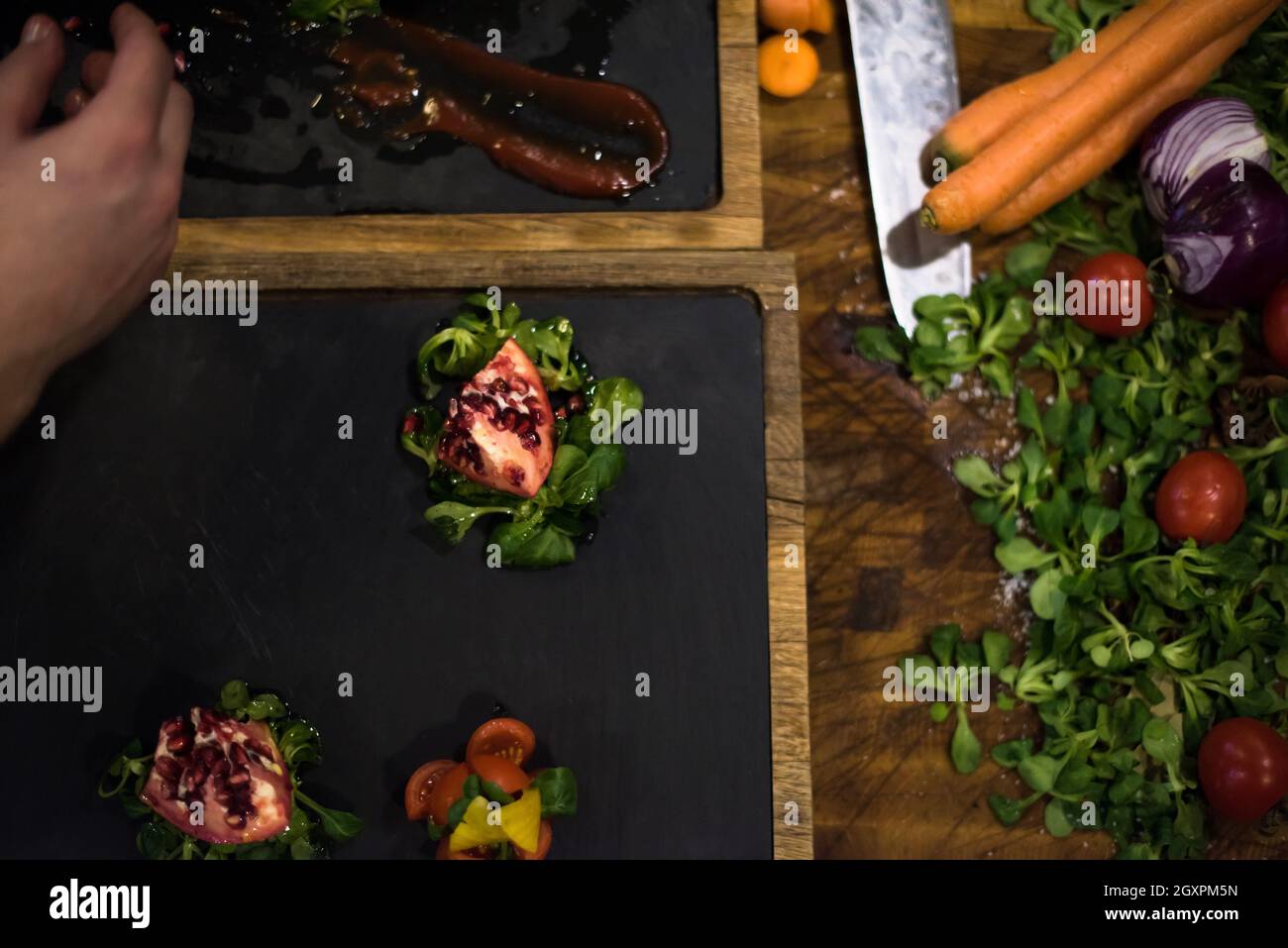 top view of Chef hands in hotel or restaurant kitchen serving beef ...