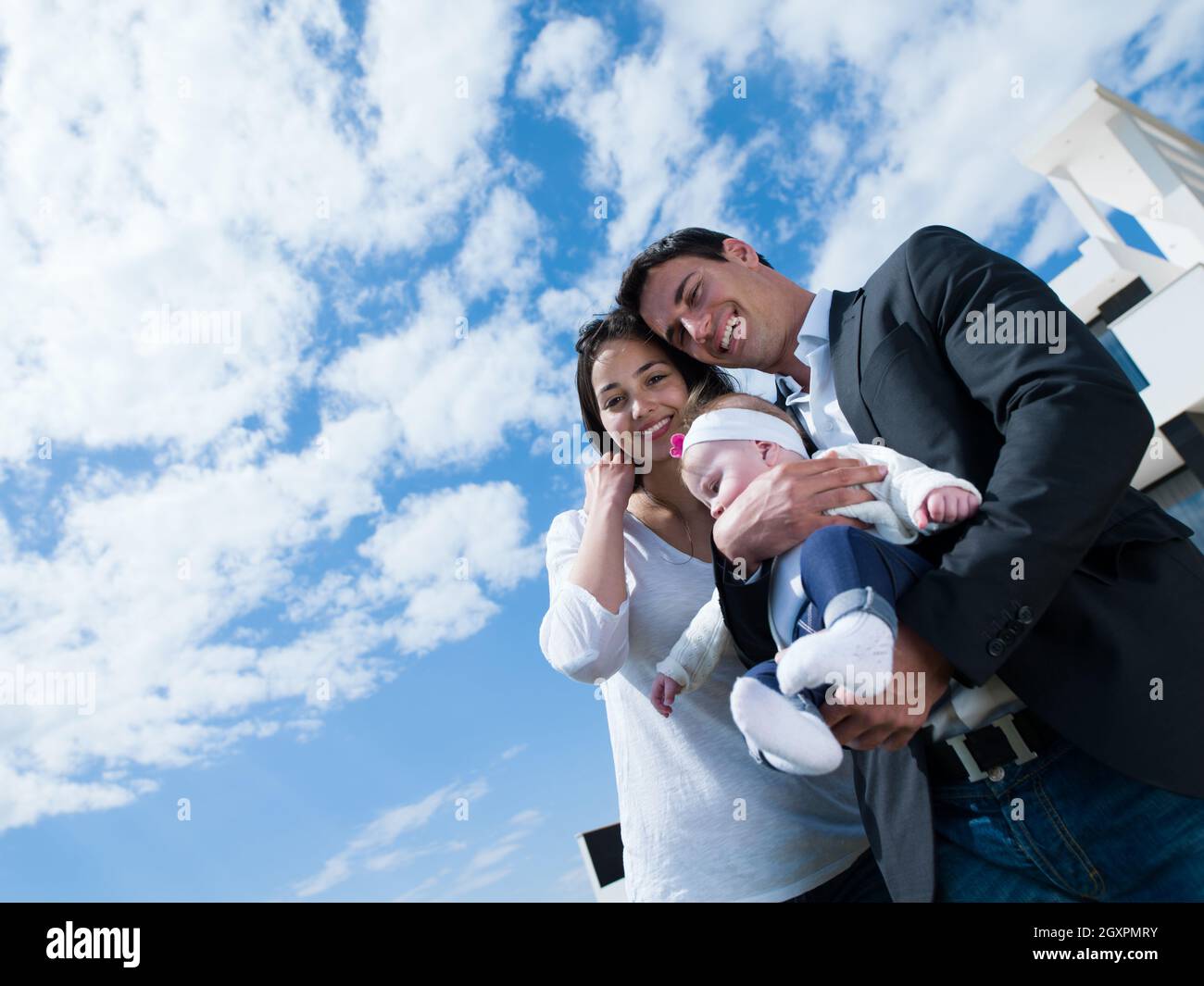 happy young family couple with beautiful new born baby have fun at ...