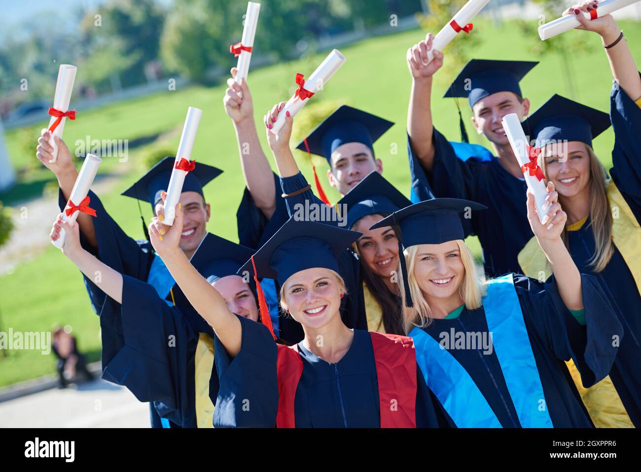 young graduates students group standing in front of university building ...