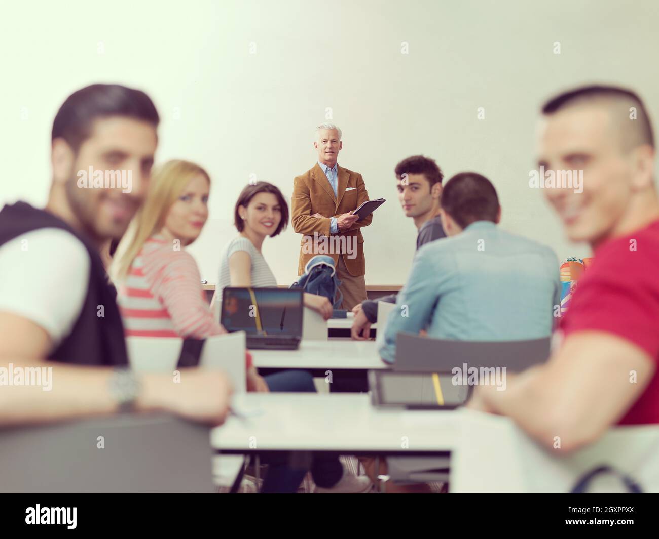group of students study with senior professor in modern school ...