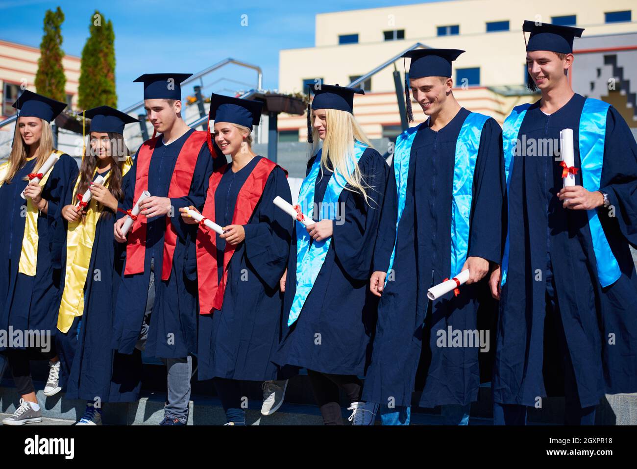 young graduates students group standing in front of university building ...