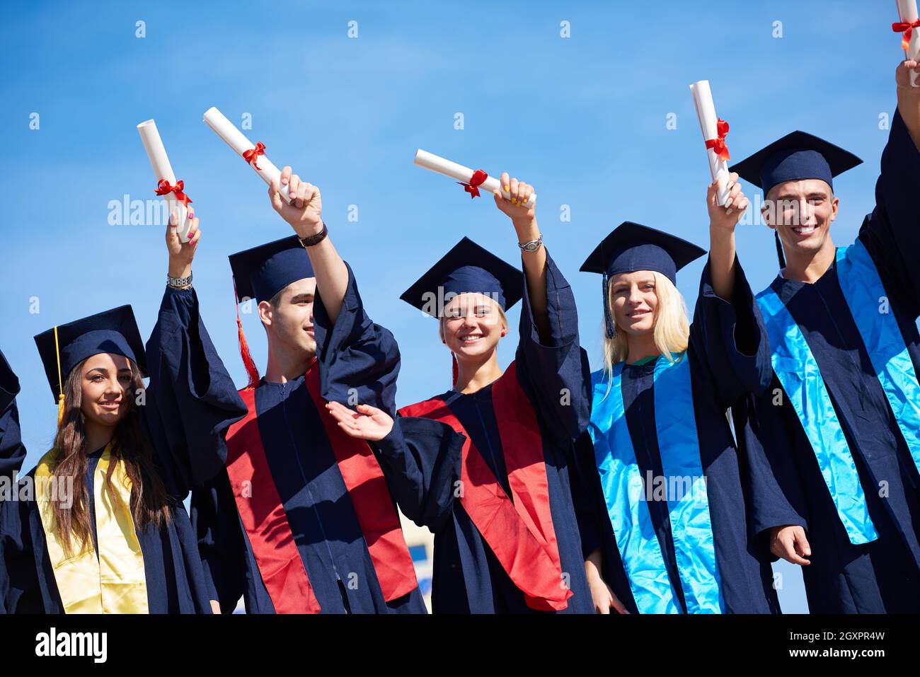 young graduates students group standing in front of university building ...