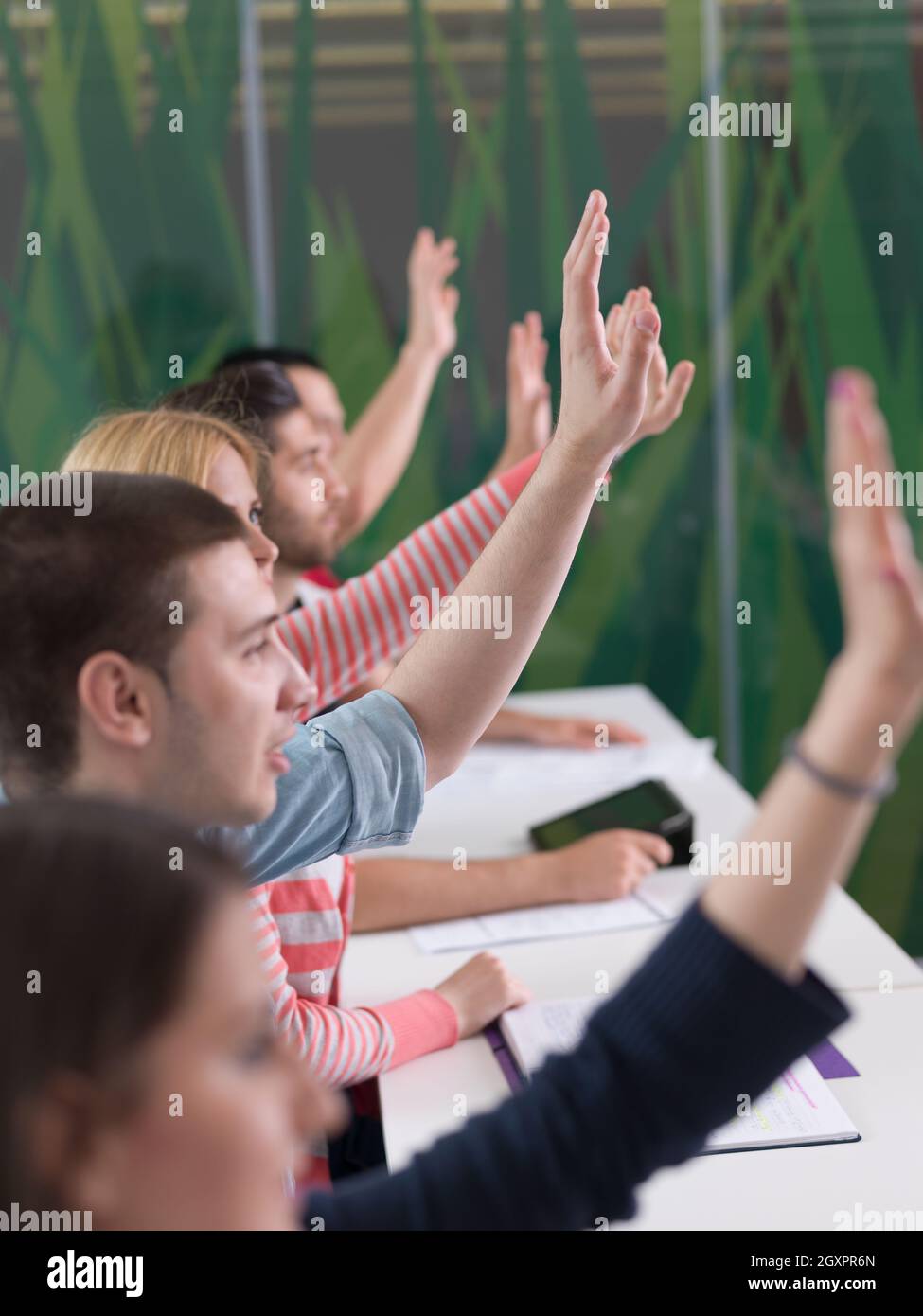 senior teacher teaching lessons, smart students group raise hands up in ...