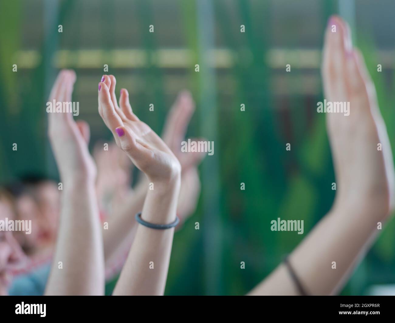 senior teacher teaching lessons, smart students group raise hands up in ...