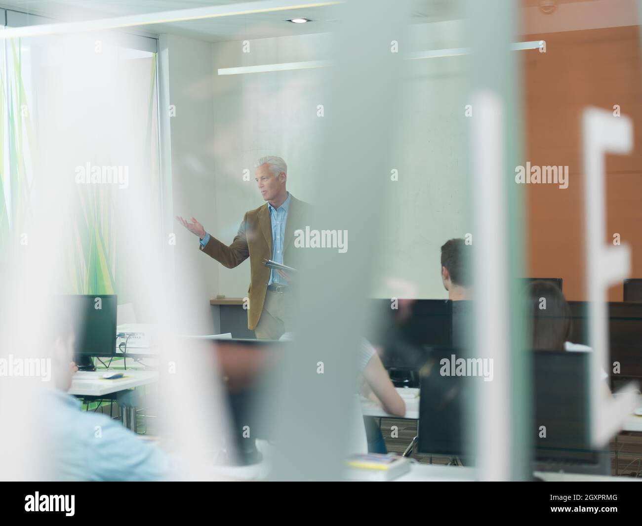 Teacher presenting project classroom hi-res stock photography and ...