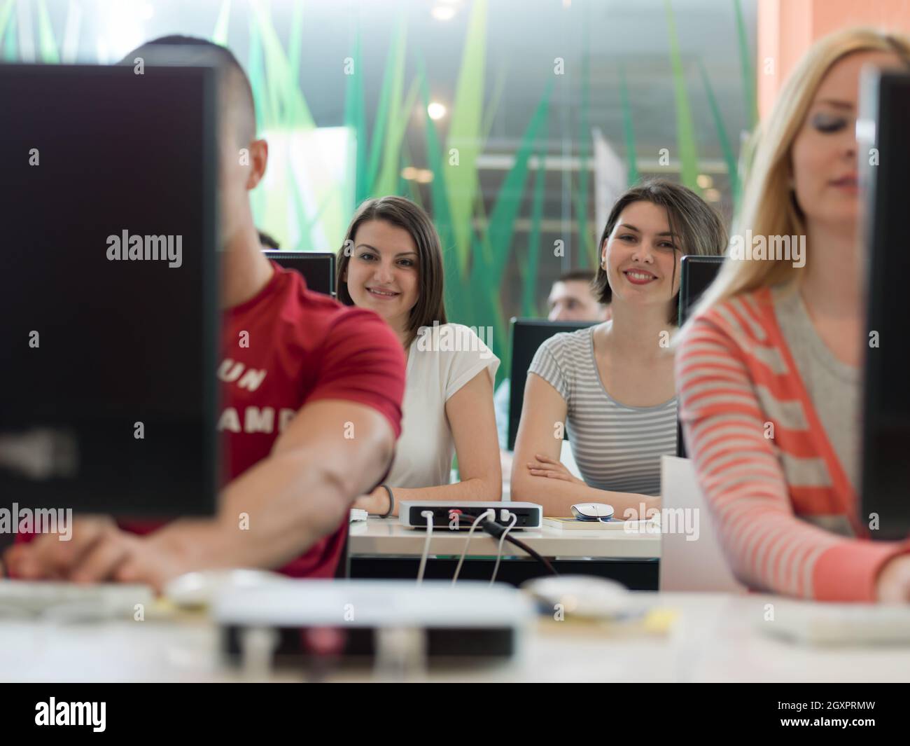 technology students group in computer lab school classroom working on ...