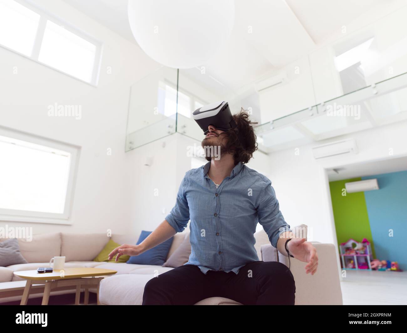 happy man getting experience using VR-headset glasses of virtual ...