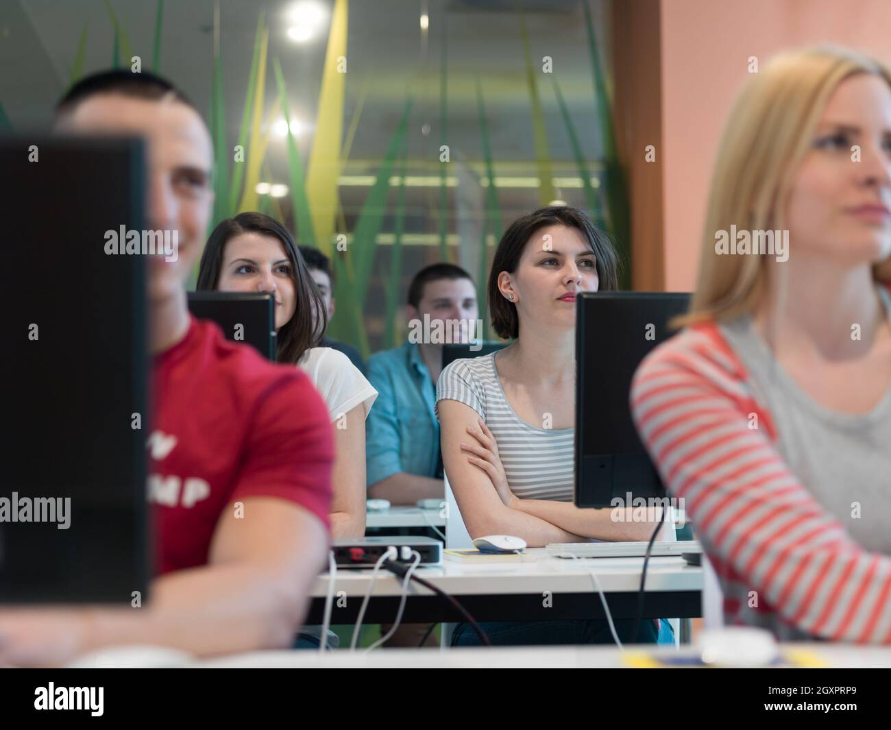technology students group in computer lab school classroom working on ...