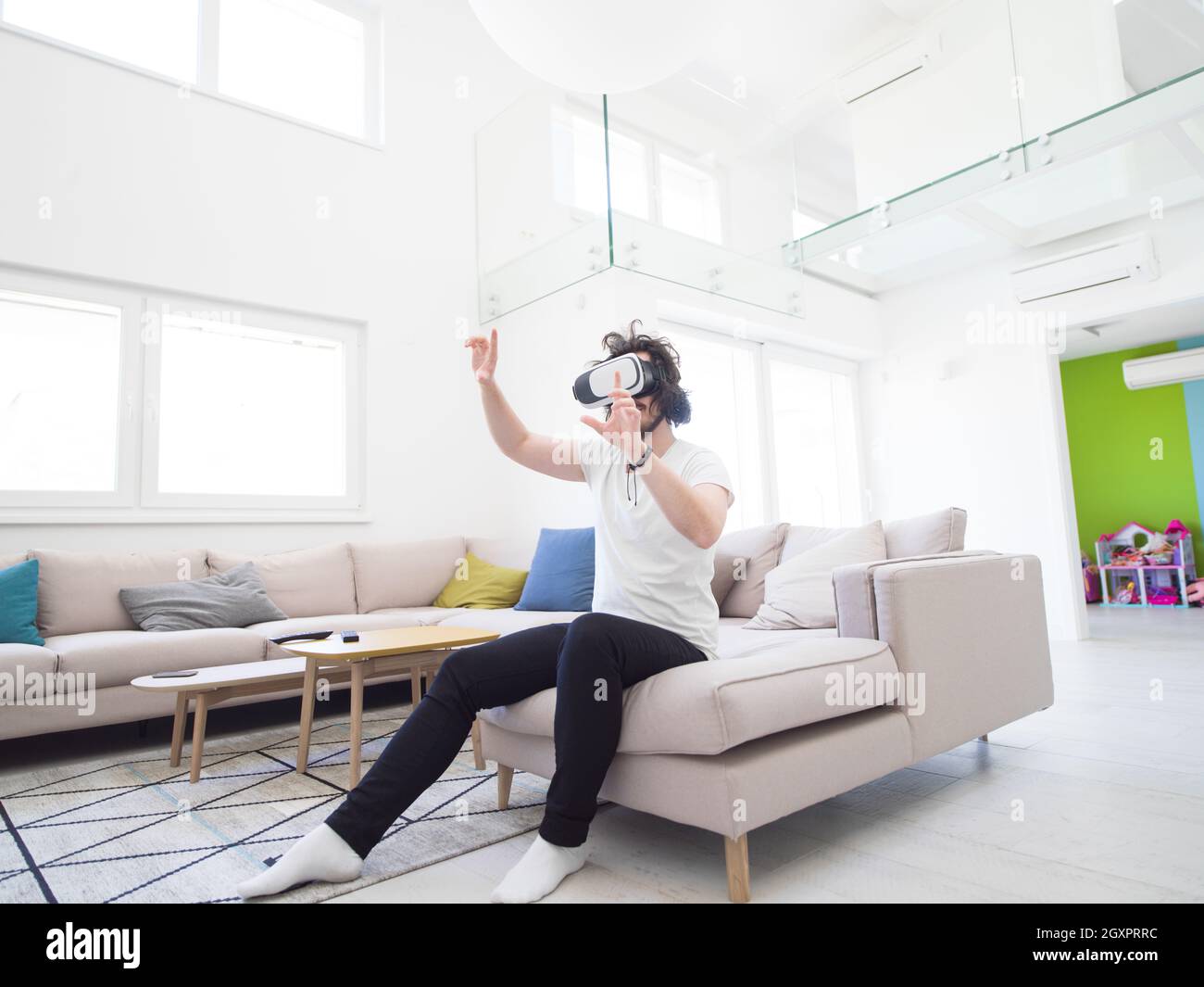 happy man getting experience using VR-headset glasses of virtual ...