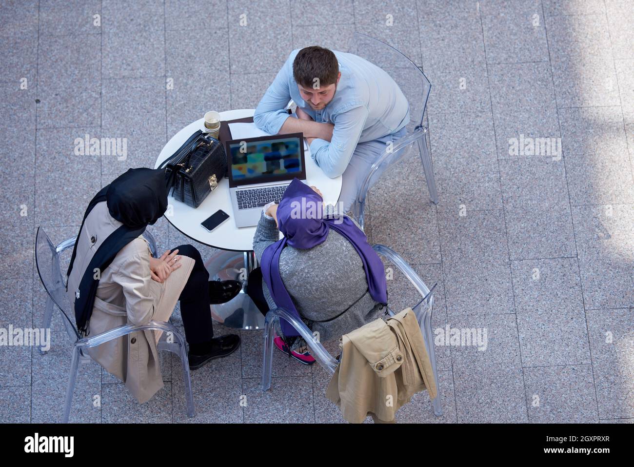 top view, group of students together at school table working homework ...