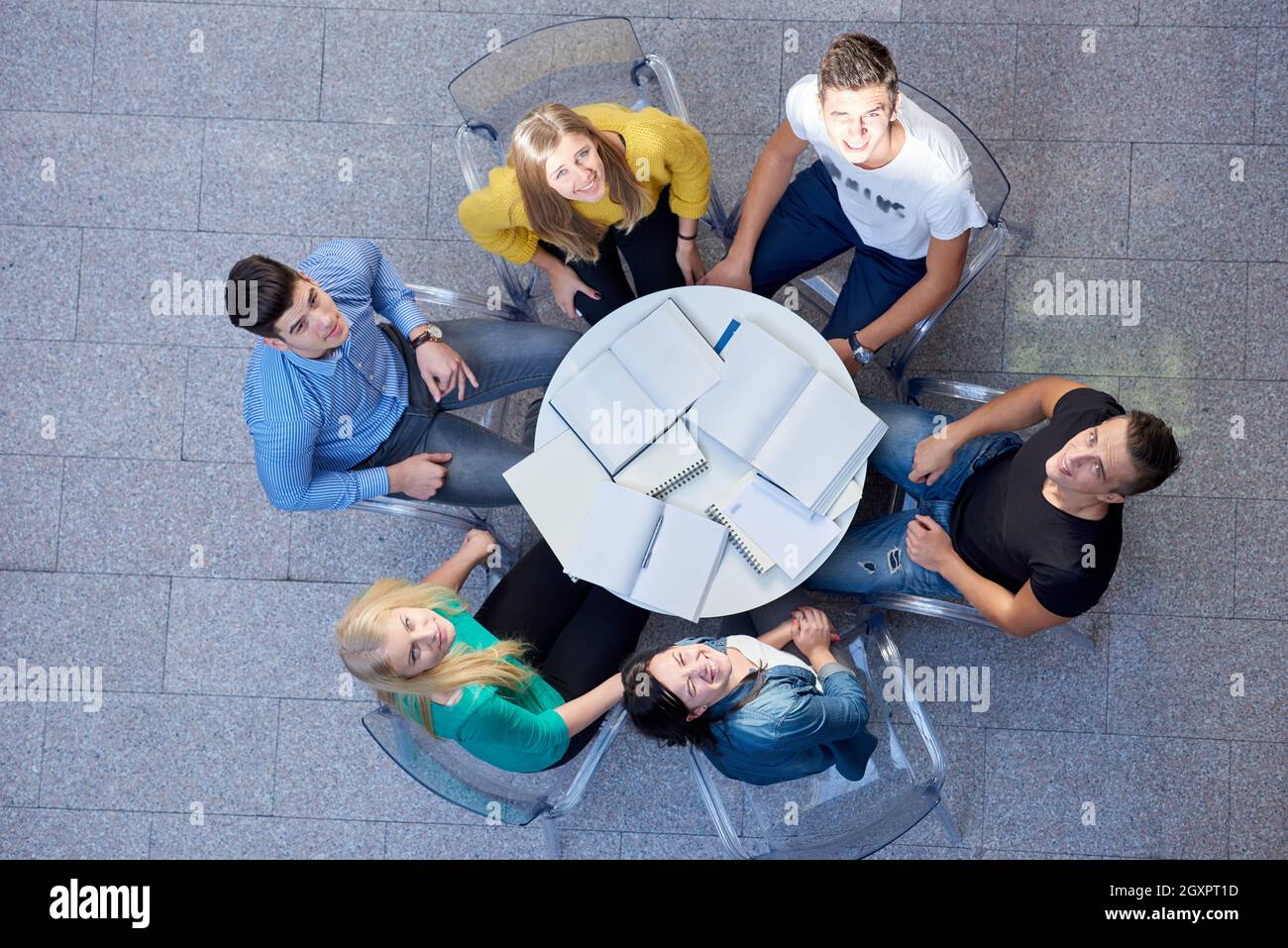 top view, group of students together at school table working homework ...