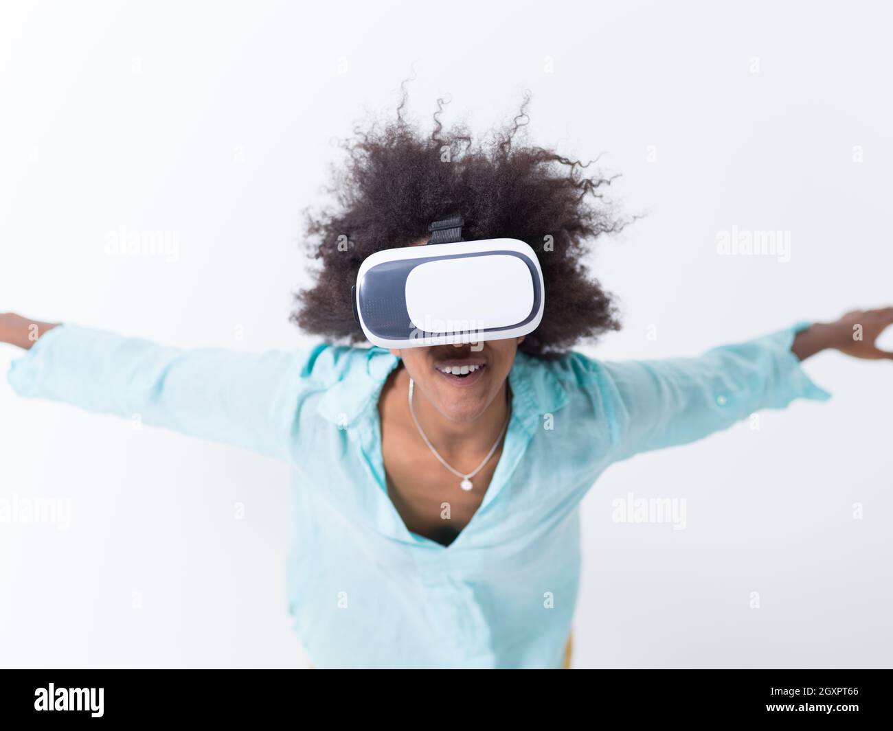 Happy african american girl getting experience using VR headset glasses ...
