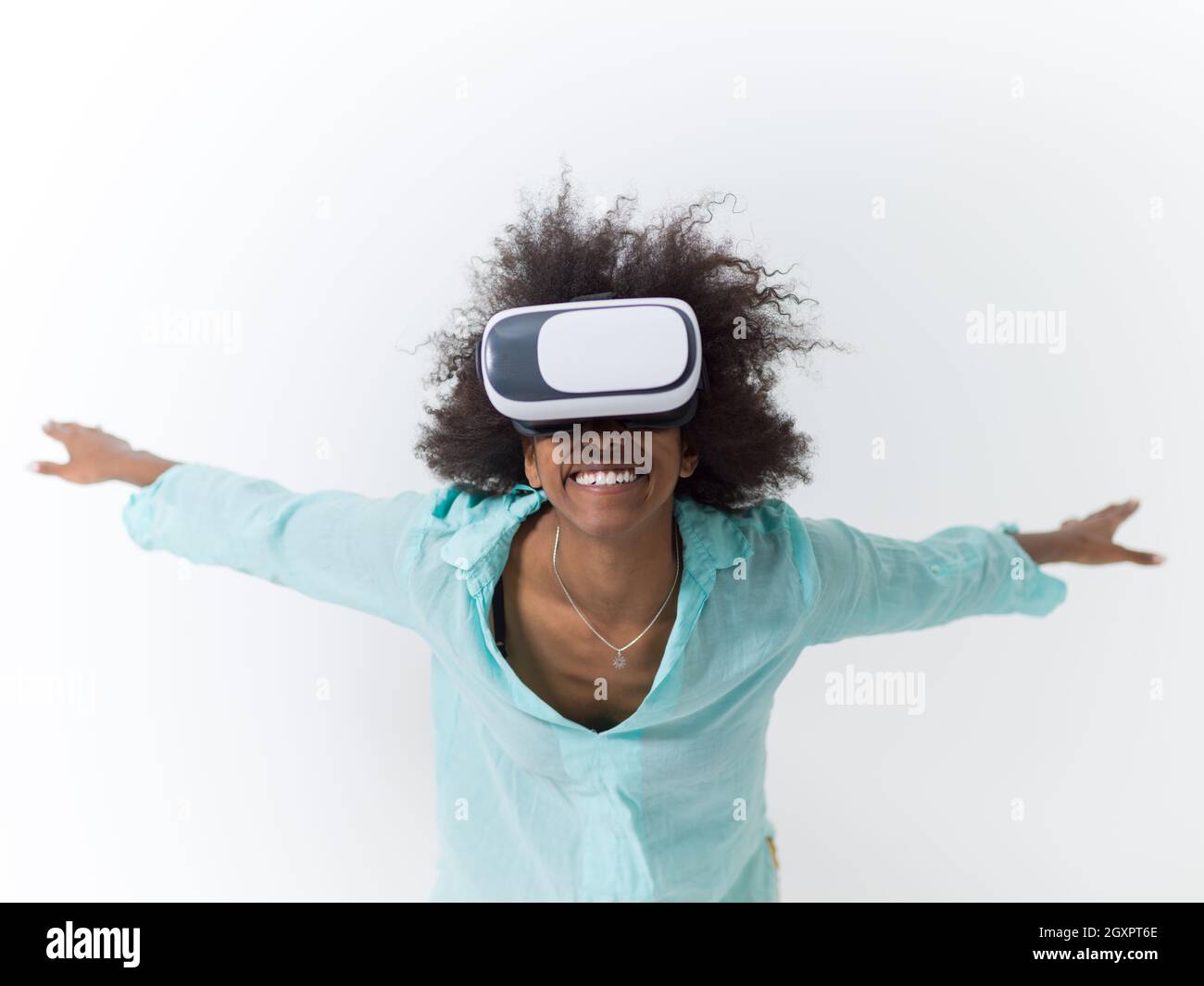Happy african american girl getting experience using VR headset glasses ...