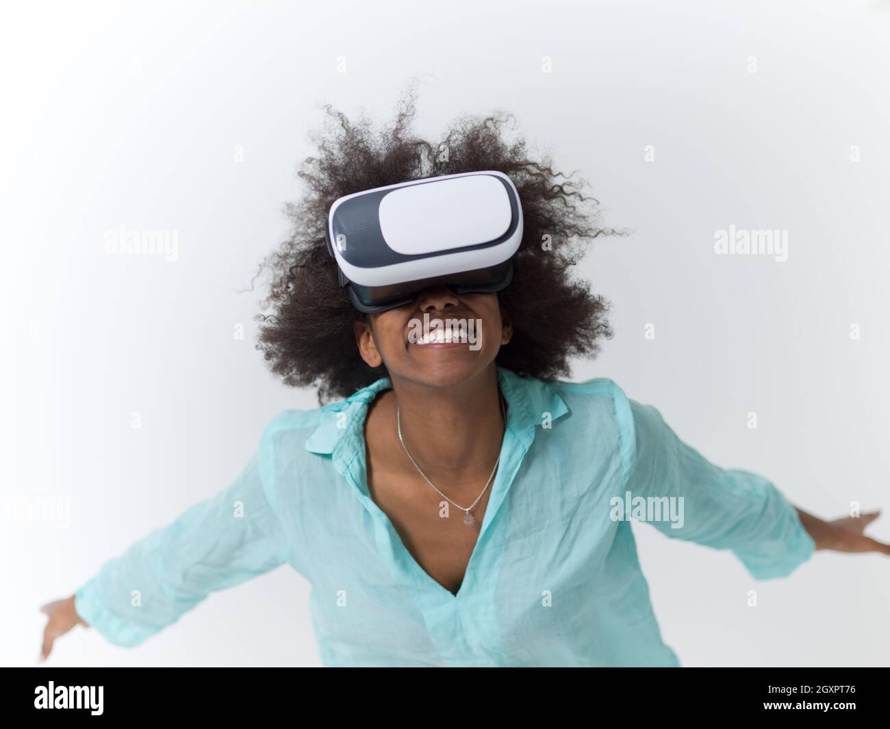 Happy african american girl getting experience using VR headset glasses ...